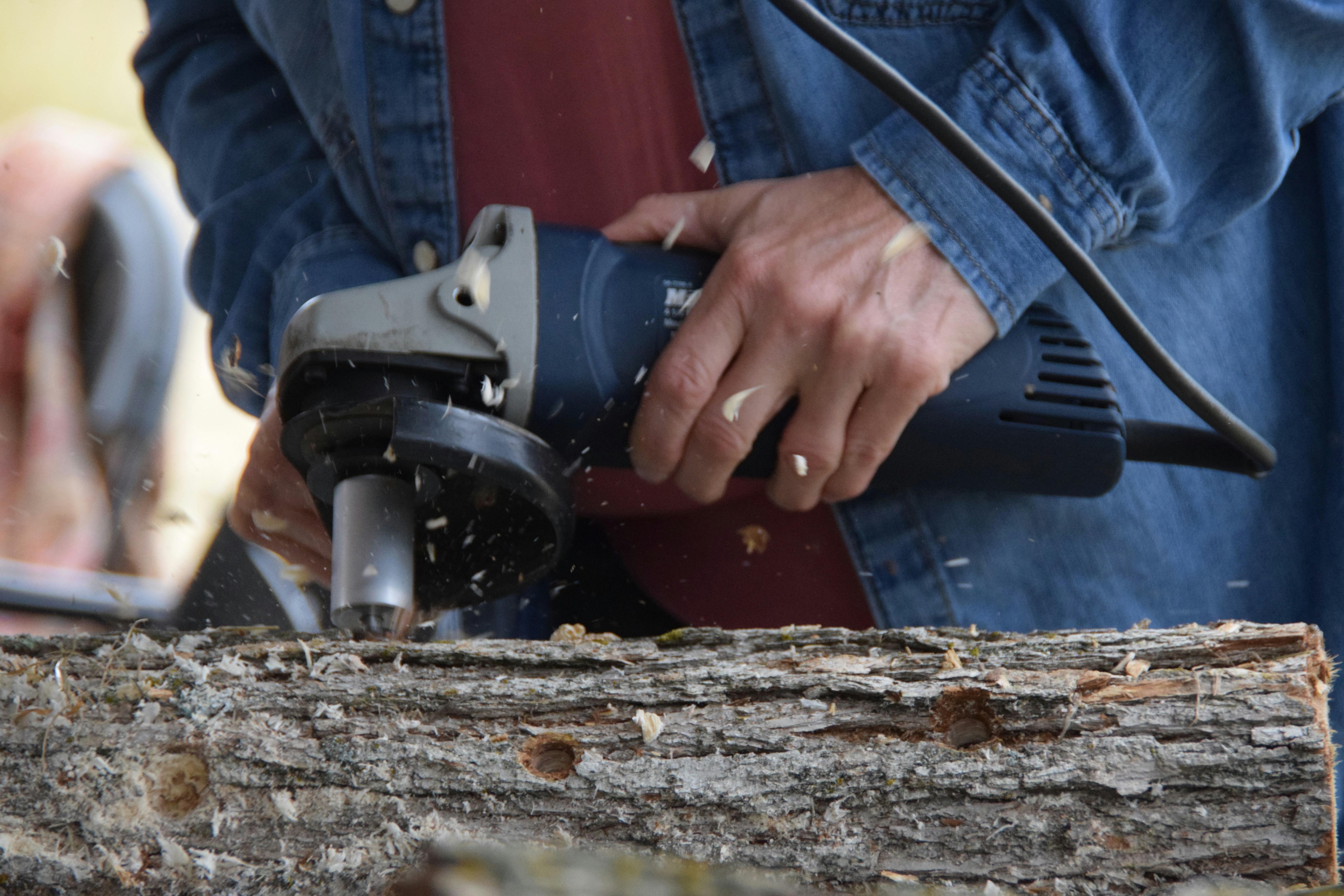 Hands at Work: A Power Tool at the Log’s Edge