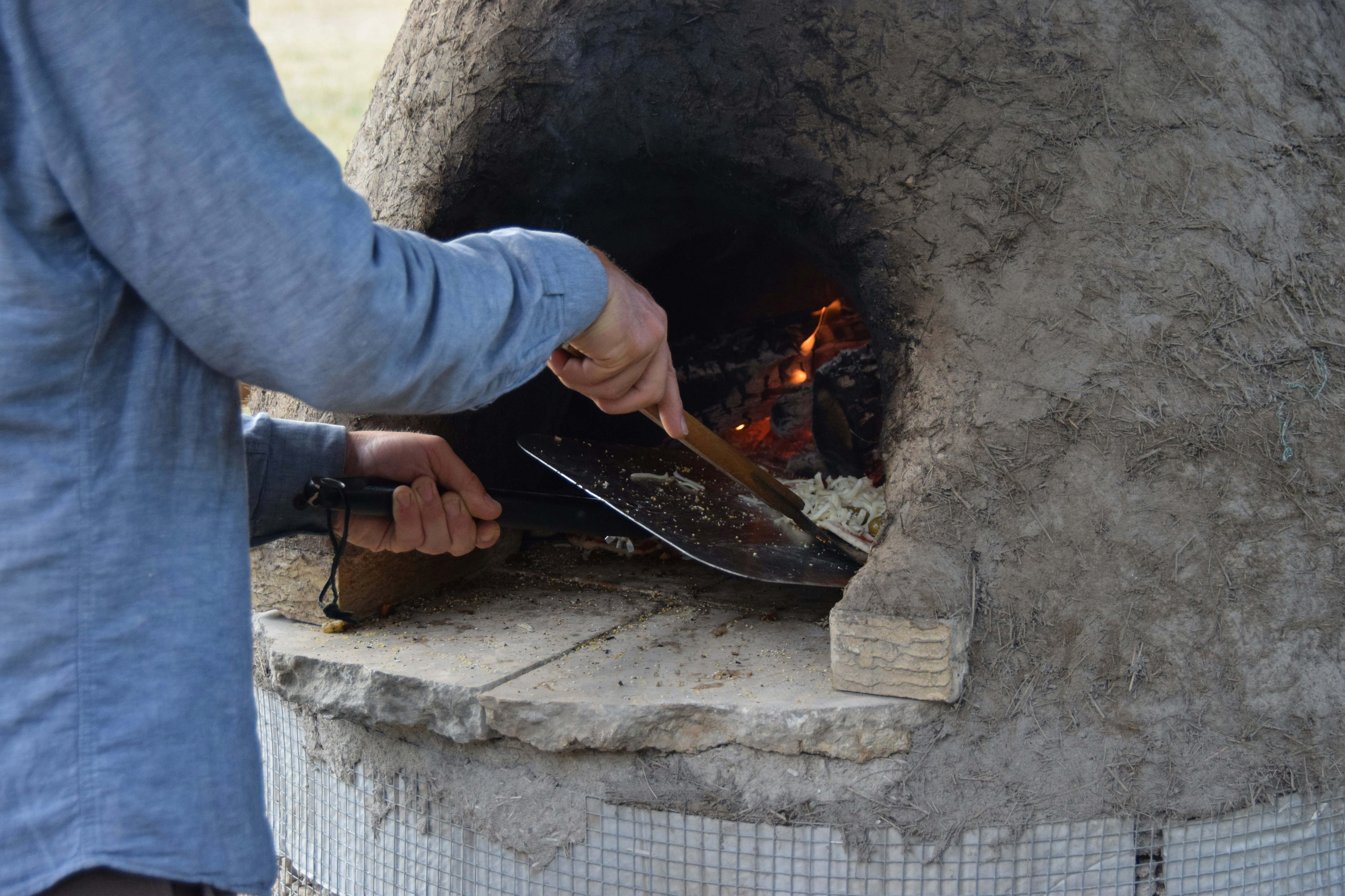Forge in Focus: Hands at Work in the Clay Oven