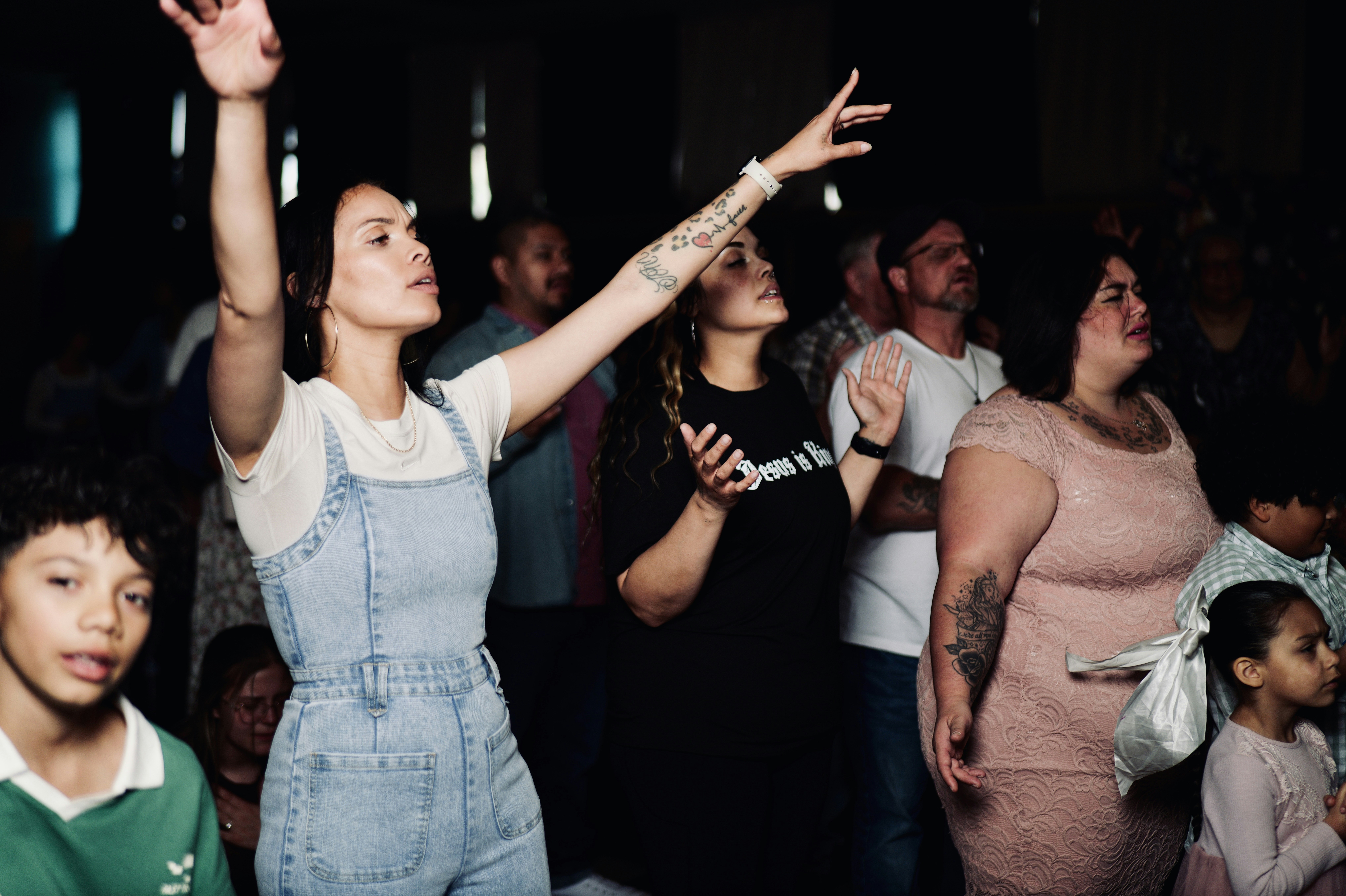 Hands Raised in the Spotlight: A Crowd Silhouette at a Live Event