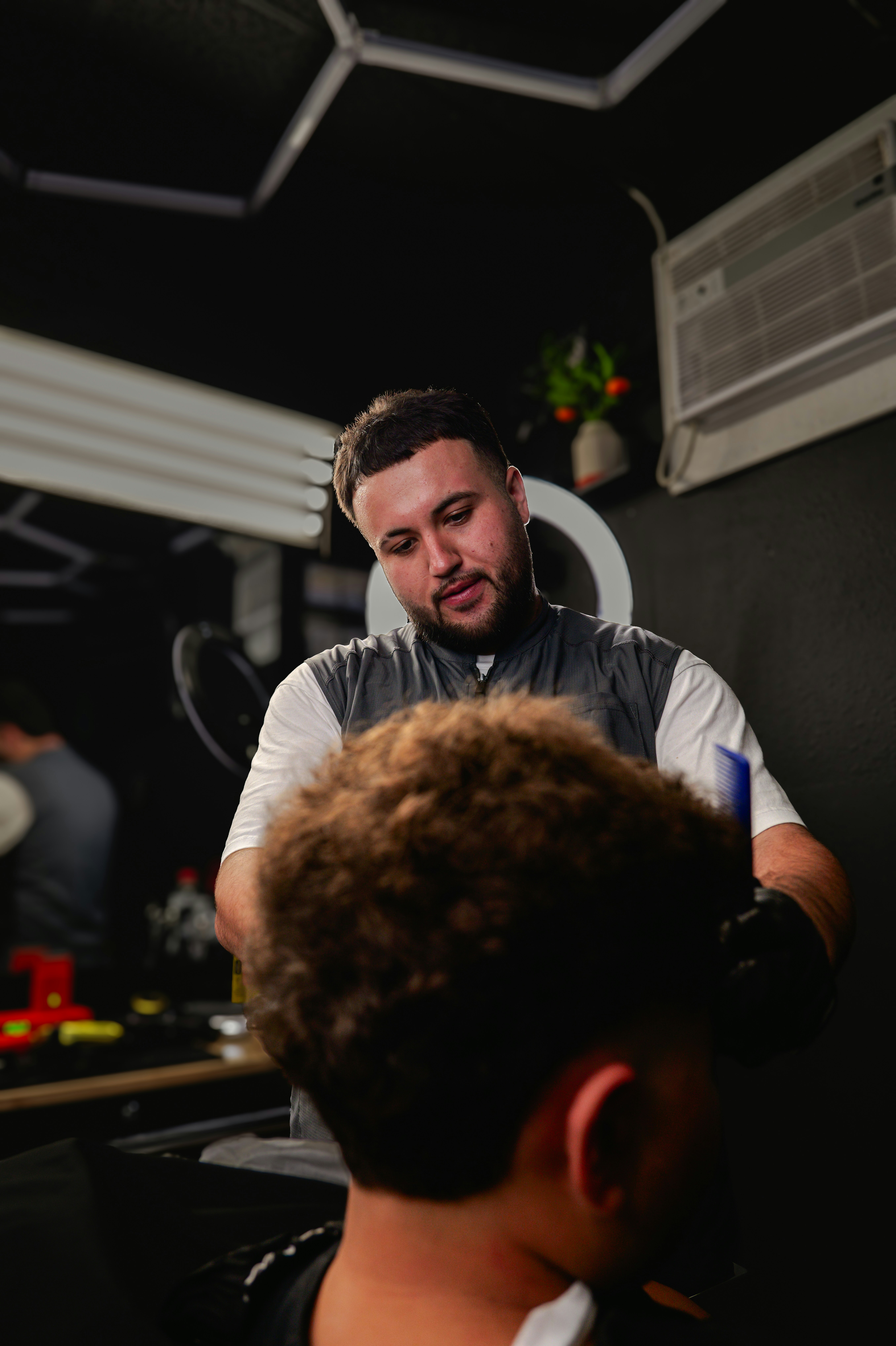 Barber at Dawn: A Focused Moment in the Studio
