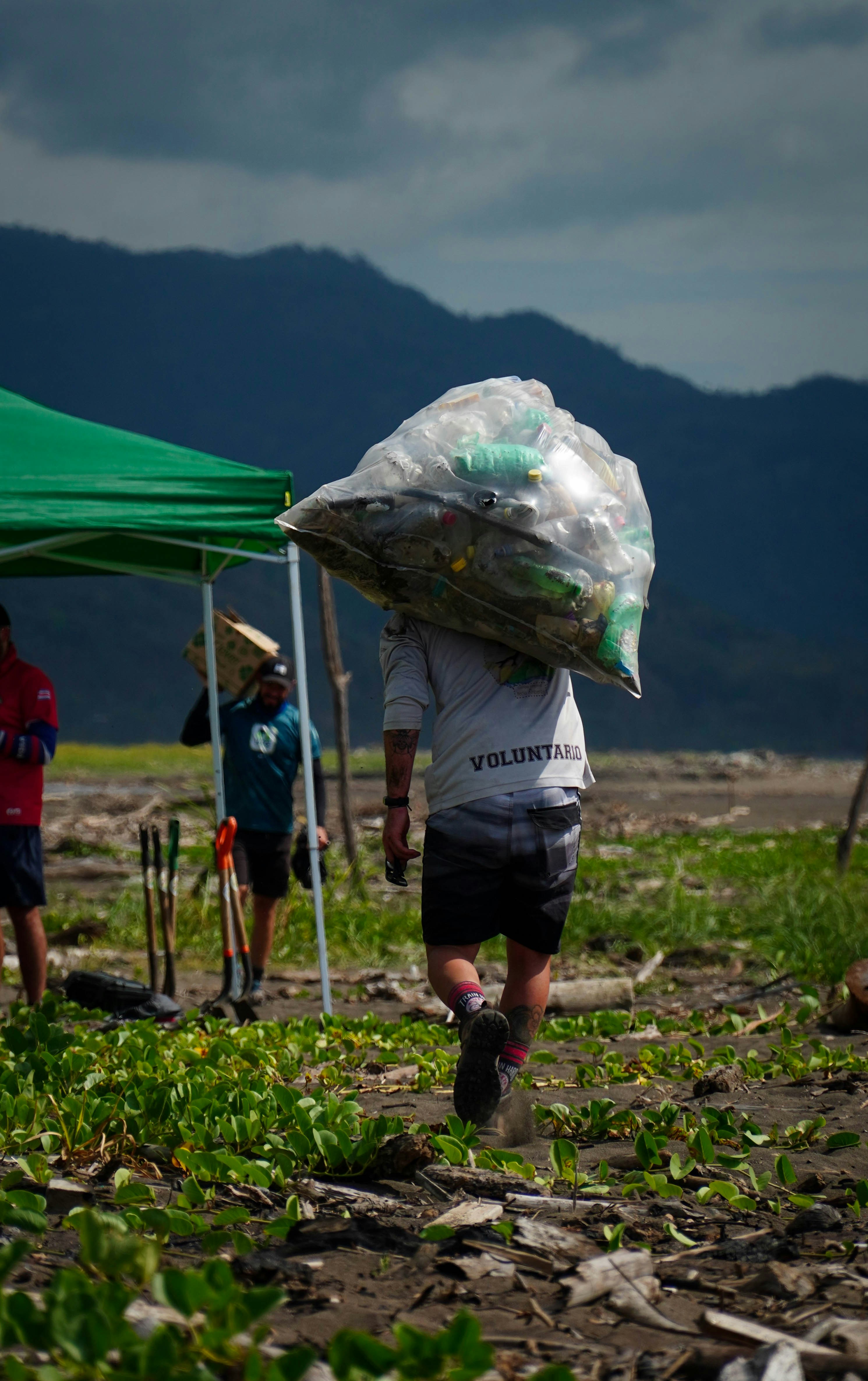 Volunteer Carrying a Burden: A Day by the Riverbank