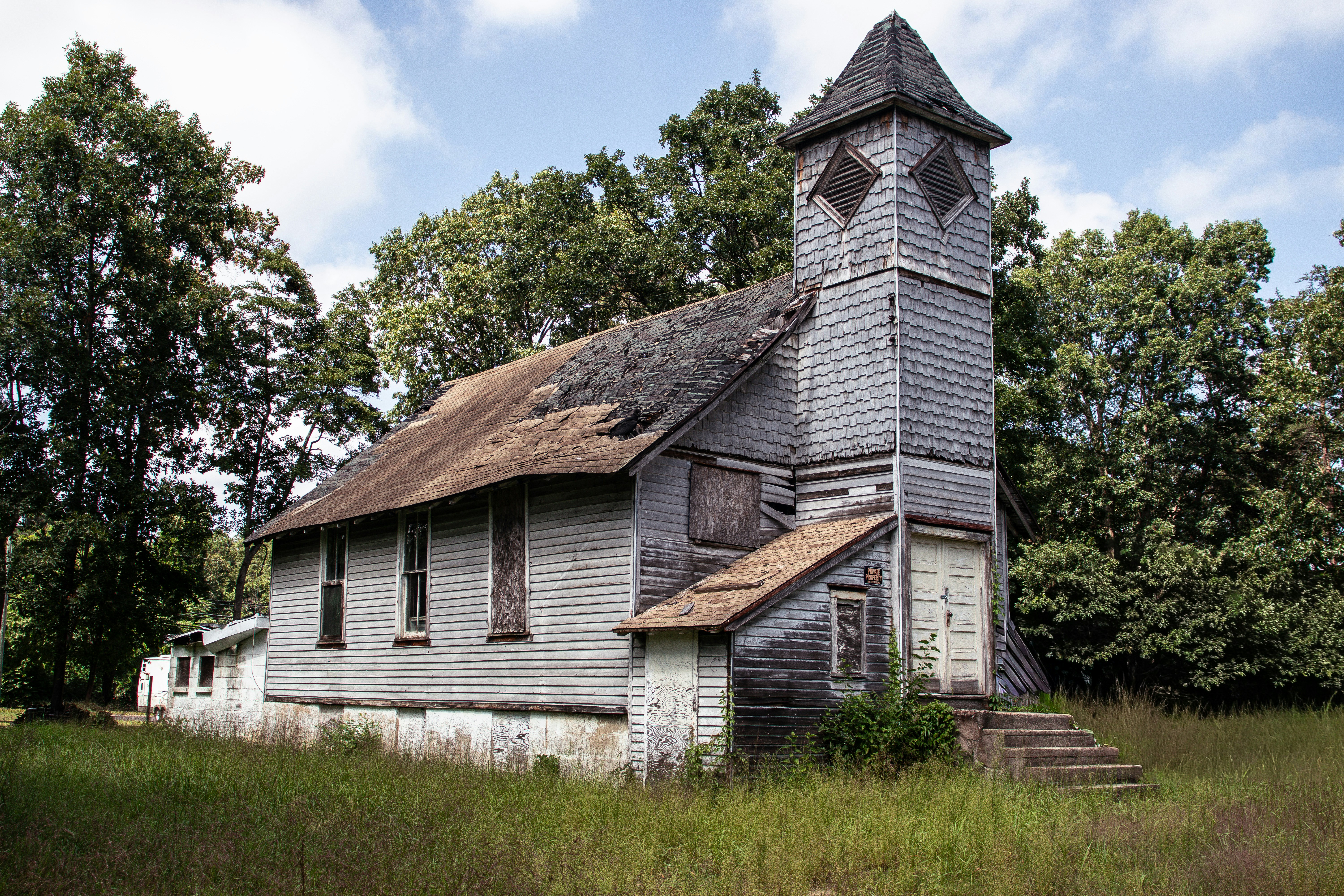 Weathered Chapel in a Green Clearing