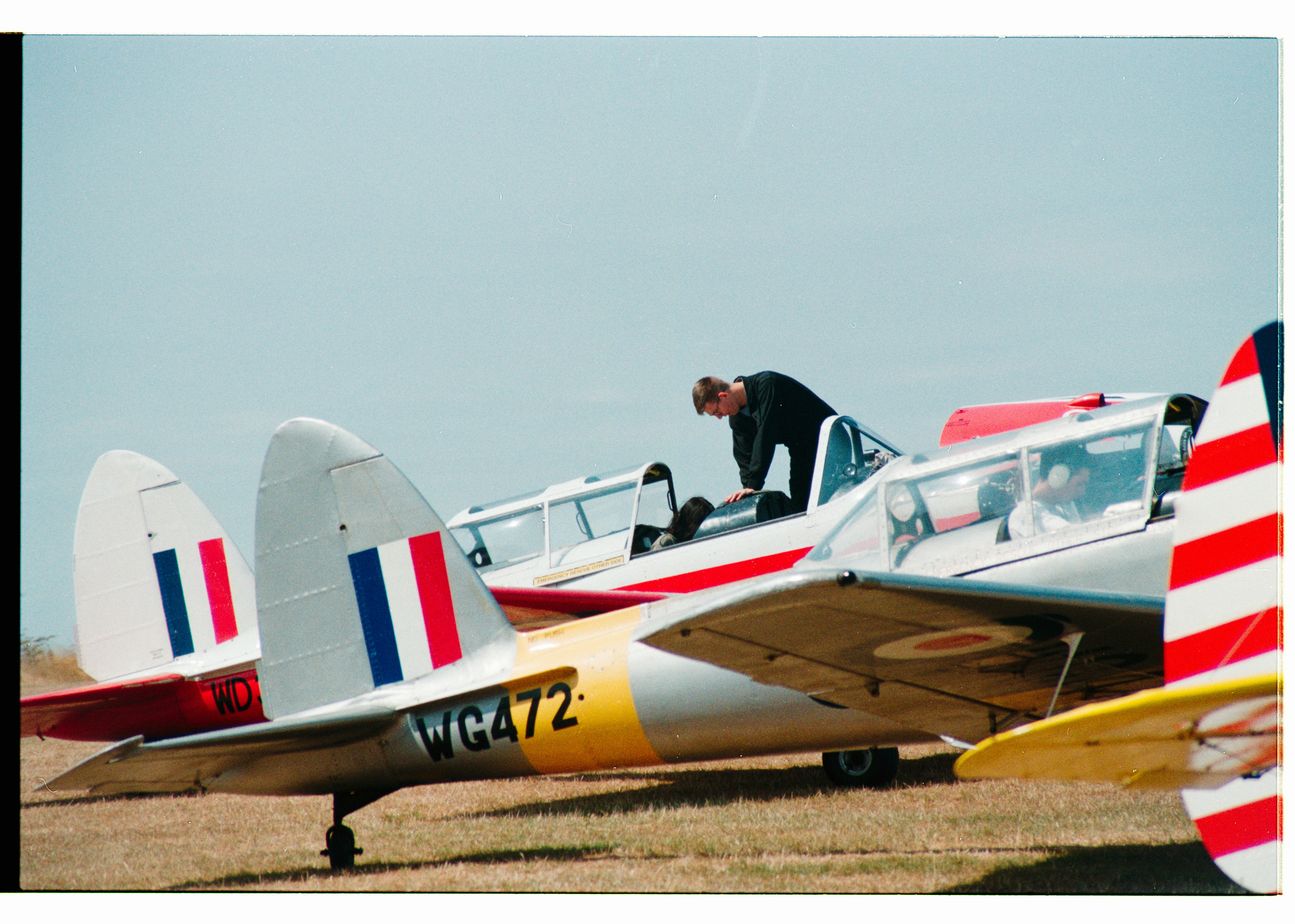 Toward the Wing: A Quiet Moment Between Restored Airframes