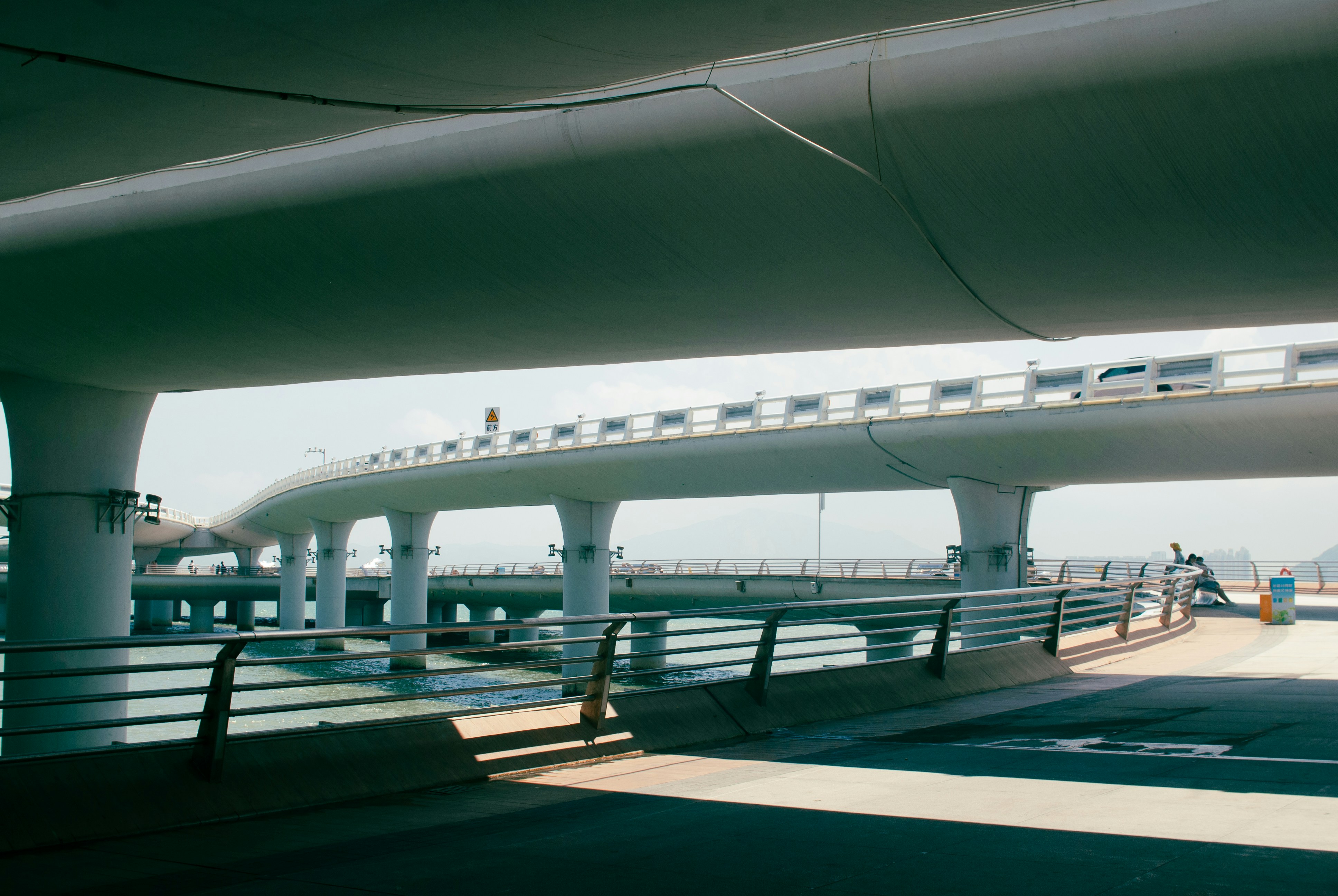 Shaded Overpass Corridor at a Seaside Walkway