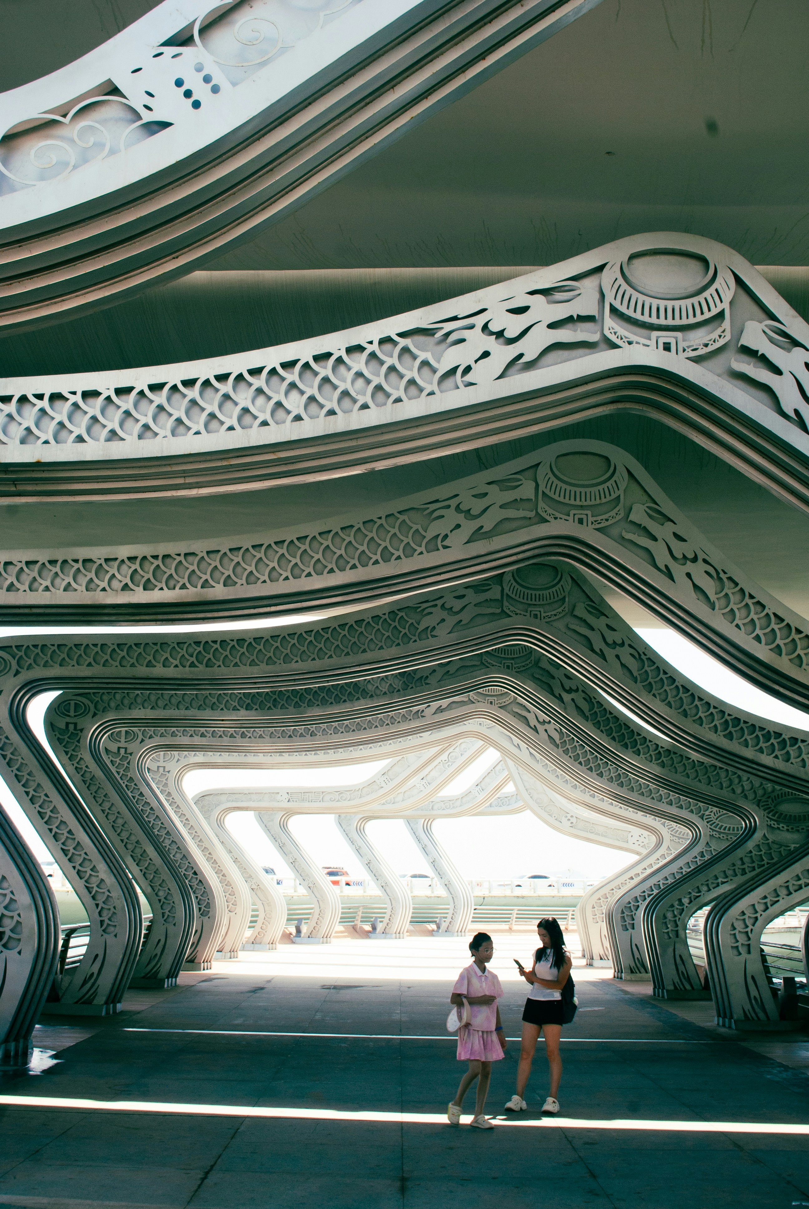 Tunnel of Ornament: Two women in the nested arches