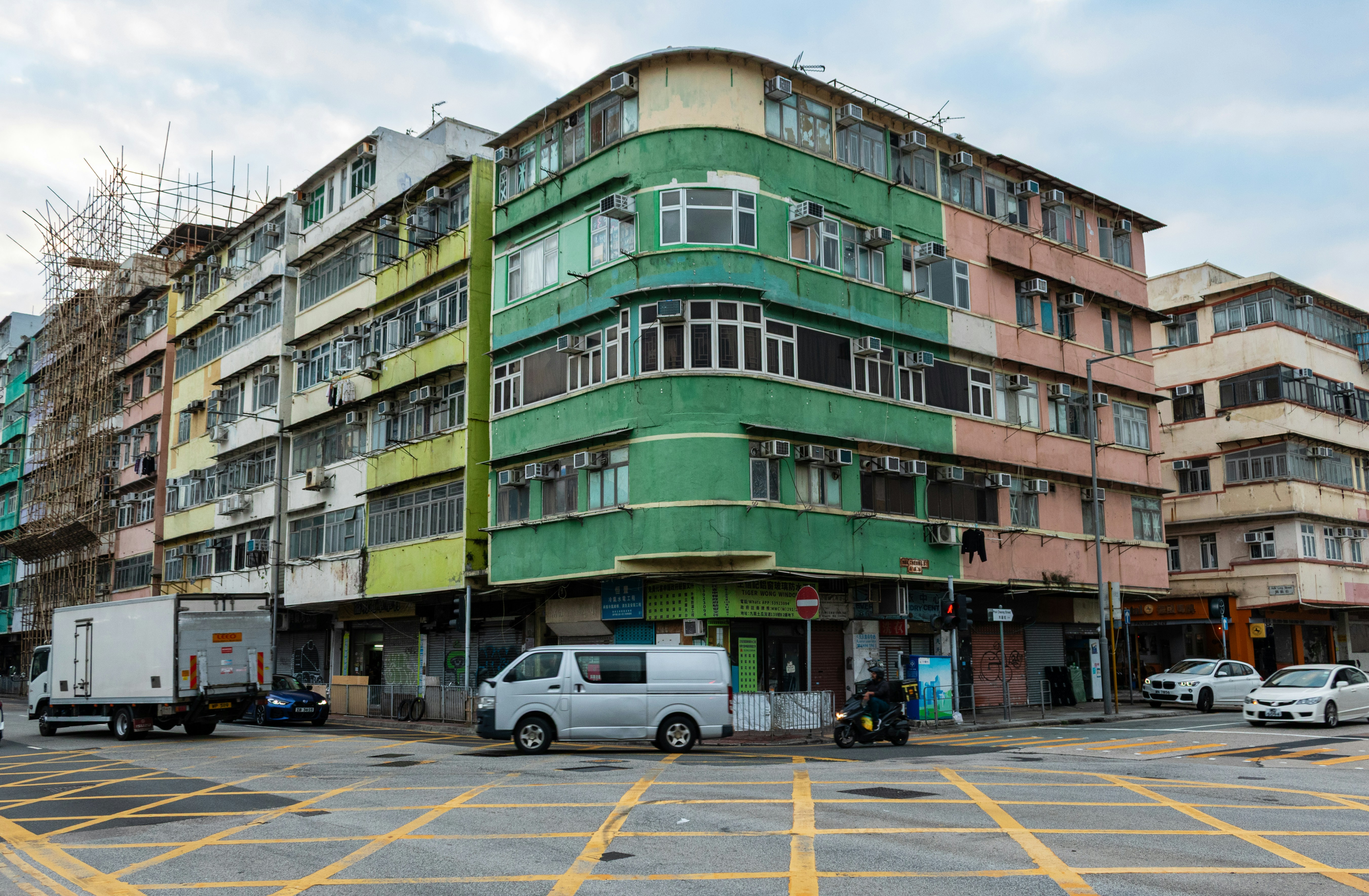 Colorful Cornered Arcade: A Row of Painted Flats Meet the Street