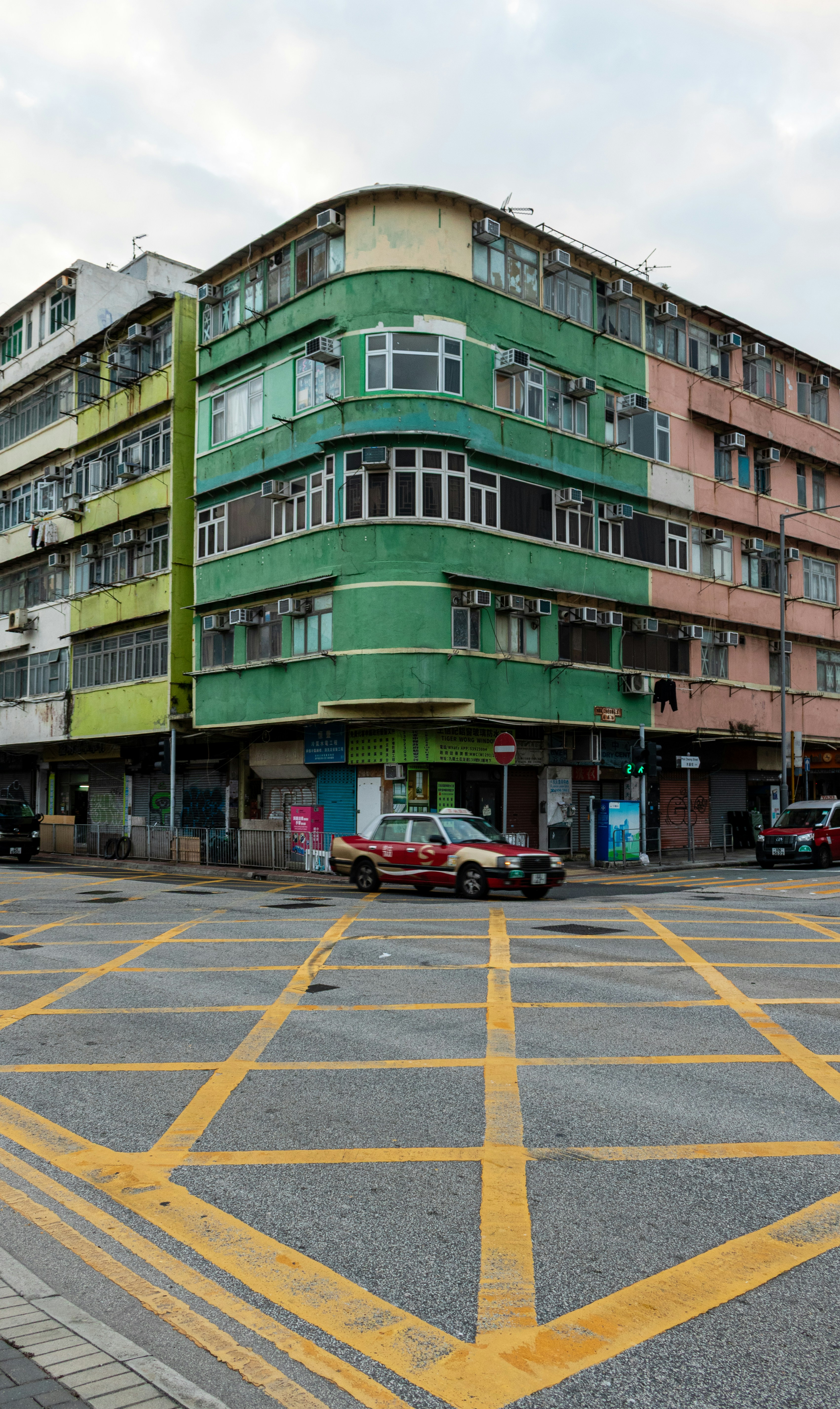 Urban Facade in Verdant Stripes: A Corner Building Reimagined