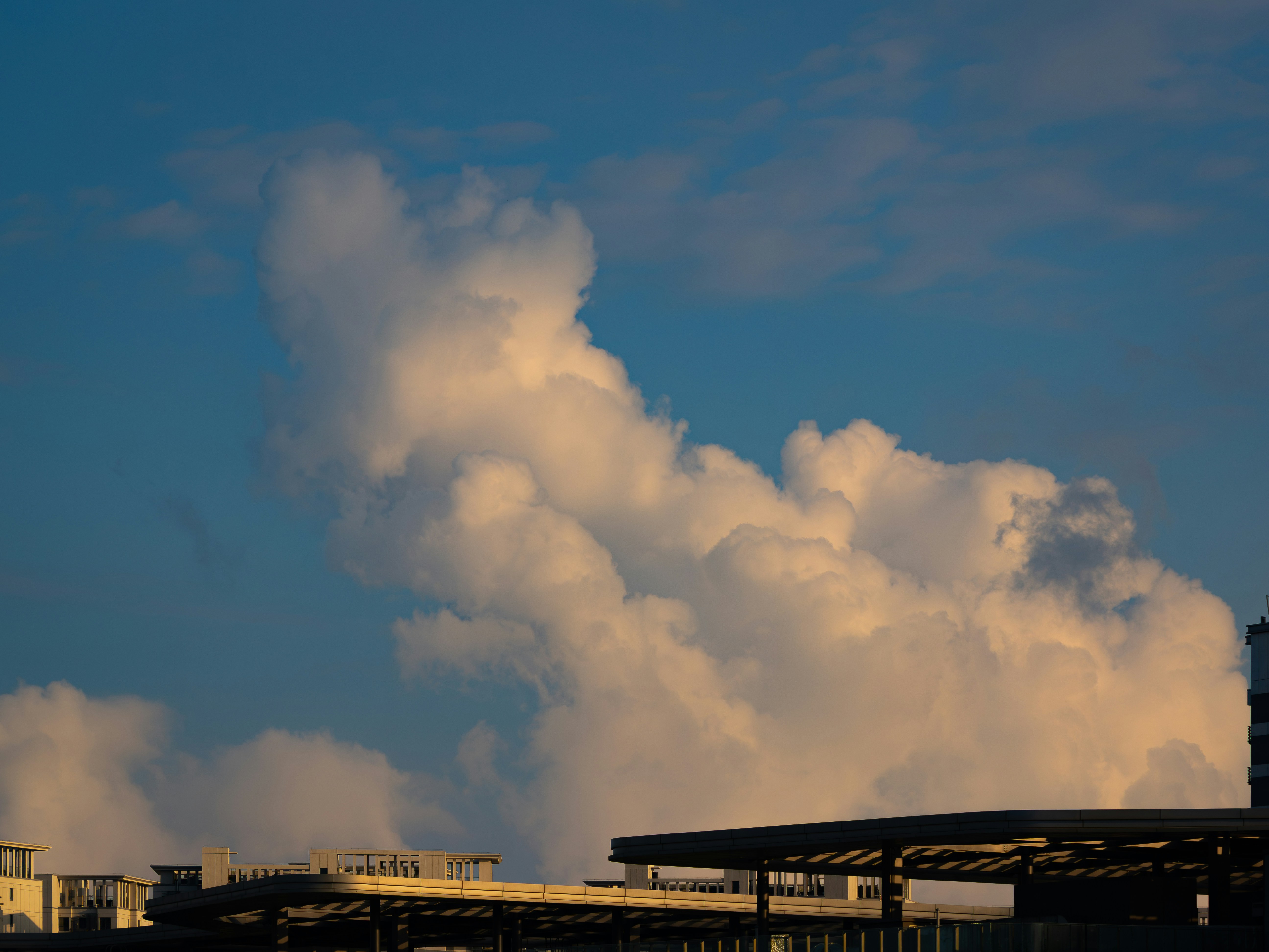 Cloudscape Over Rooftops: Quiet Evening Above the City