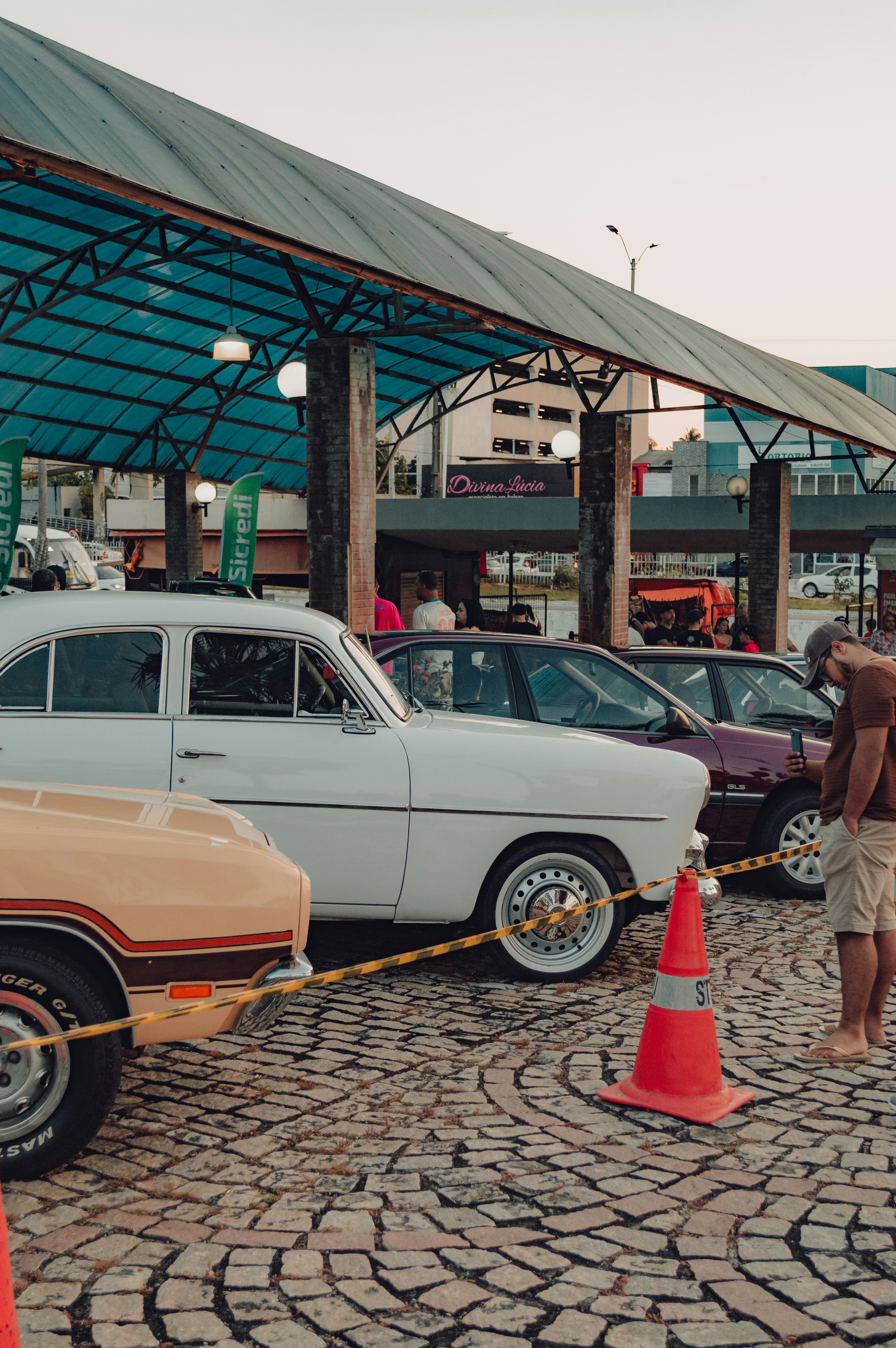 Pastel Parade: Classic Cars Under a Teal Roof