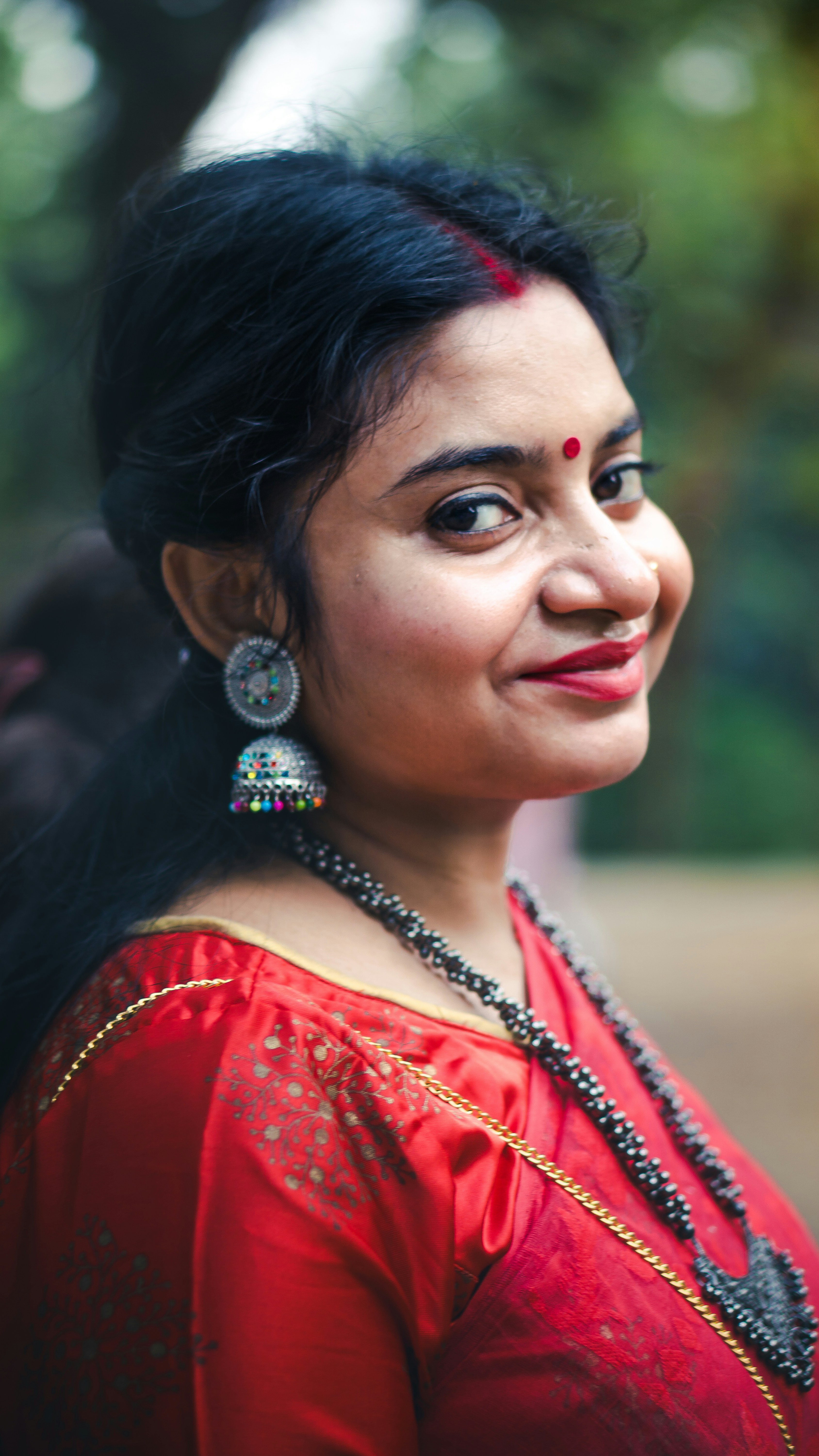 Red-Bordered Grin: A Portrait in Silk and Shadow