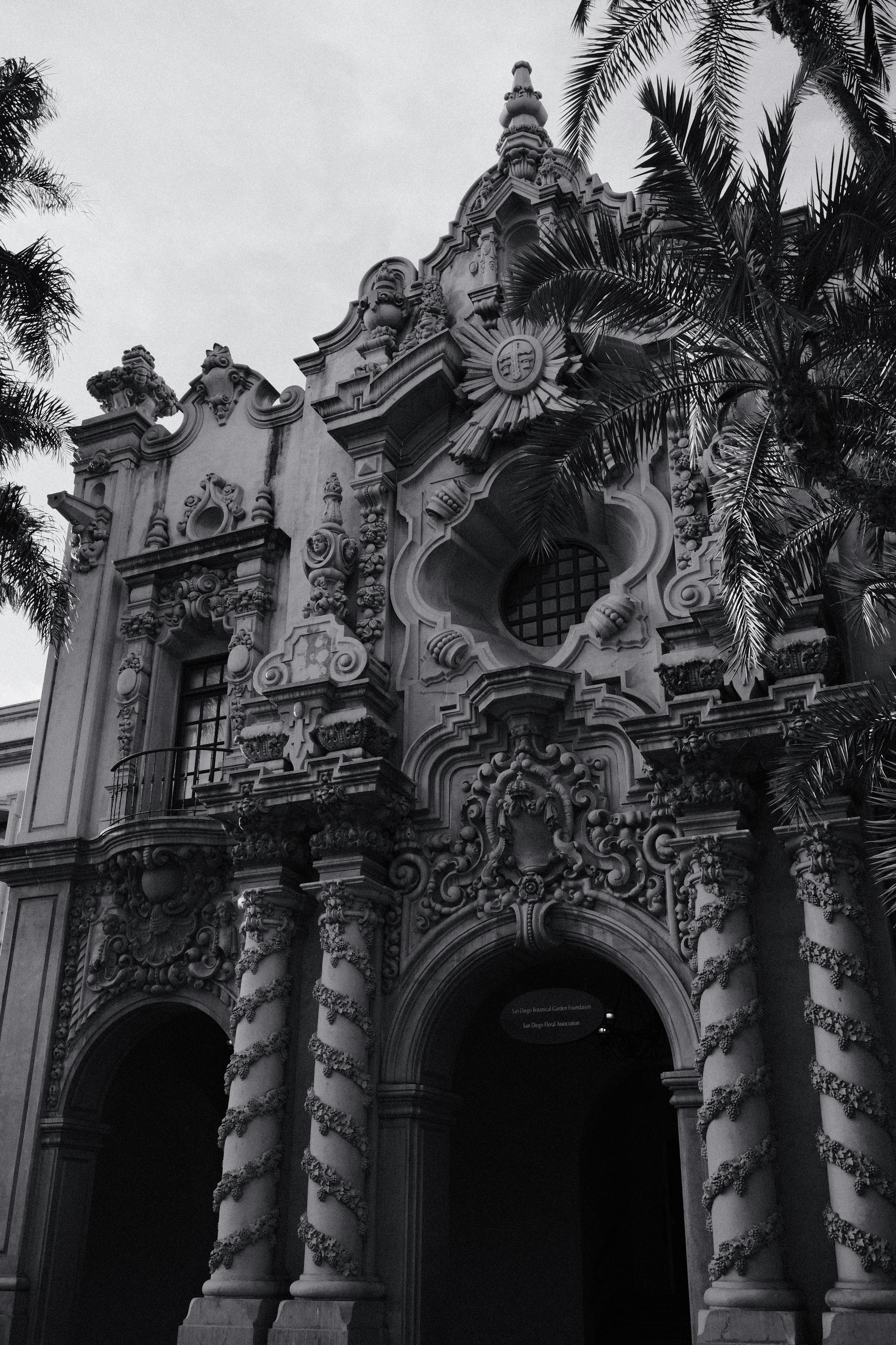 Ornate Facade of a Baroque-Influenced Building Framed by Palms