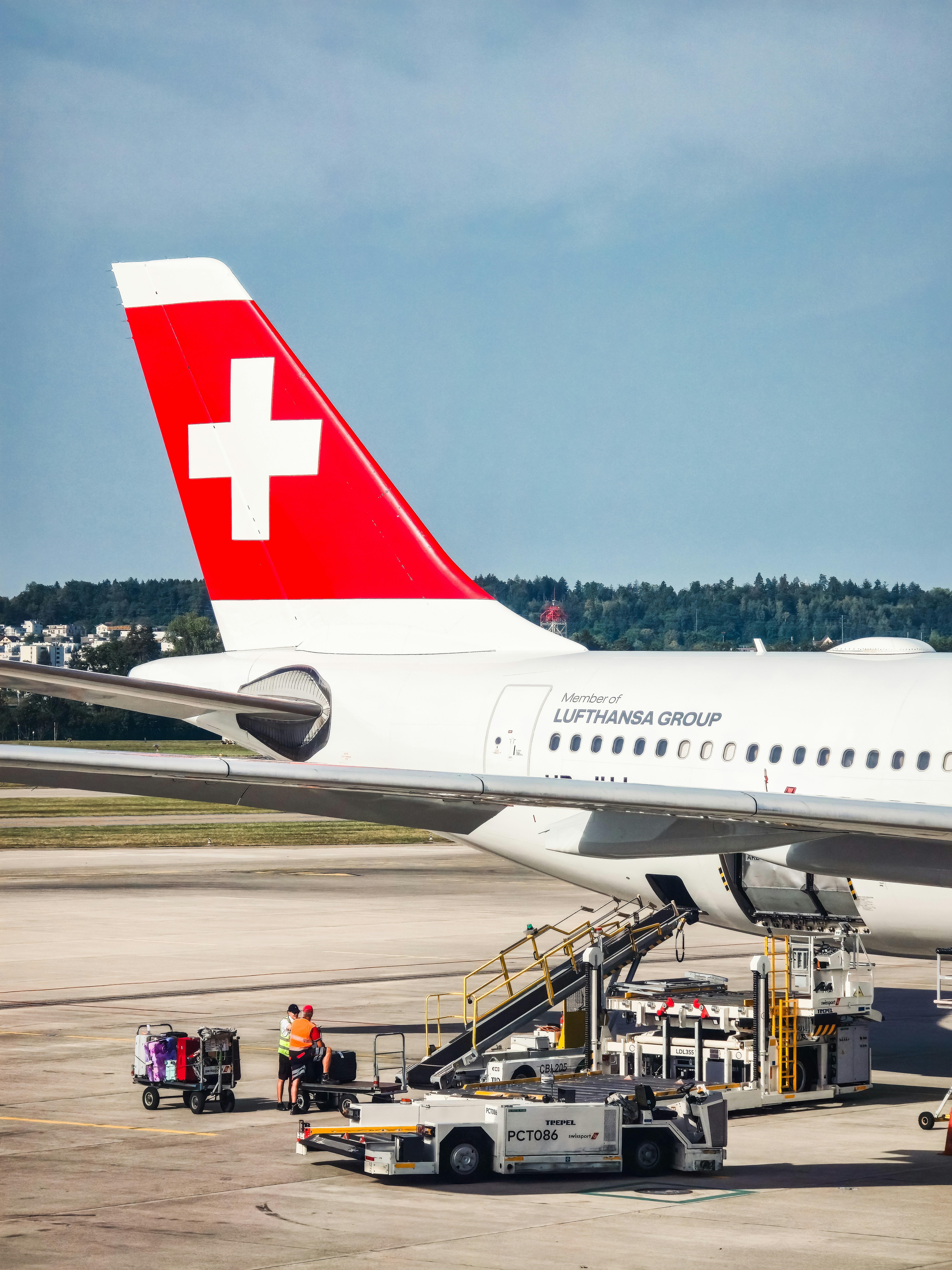 Swiss Tail, Tarmac, and Ground Crew: A Quiet Moment at the Gate