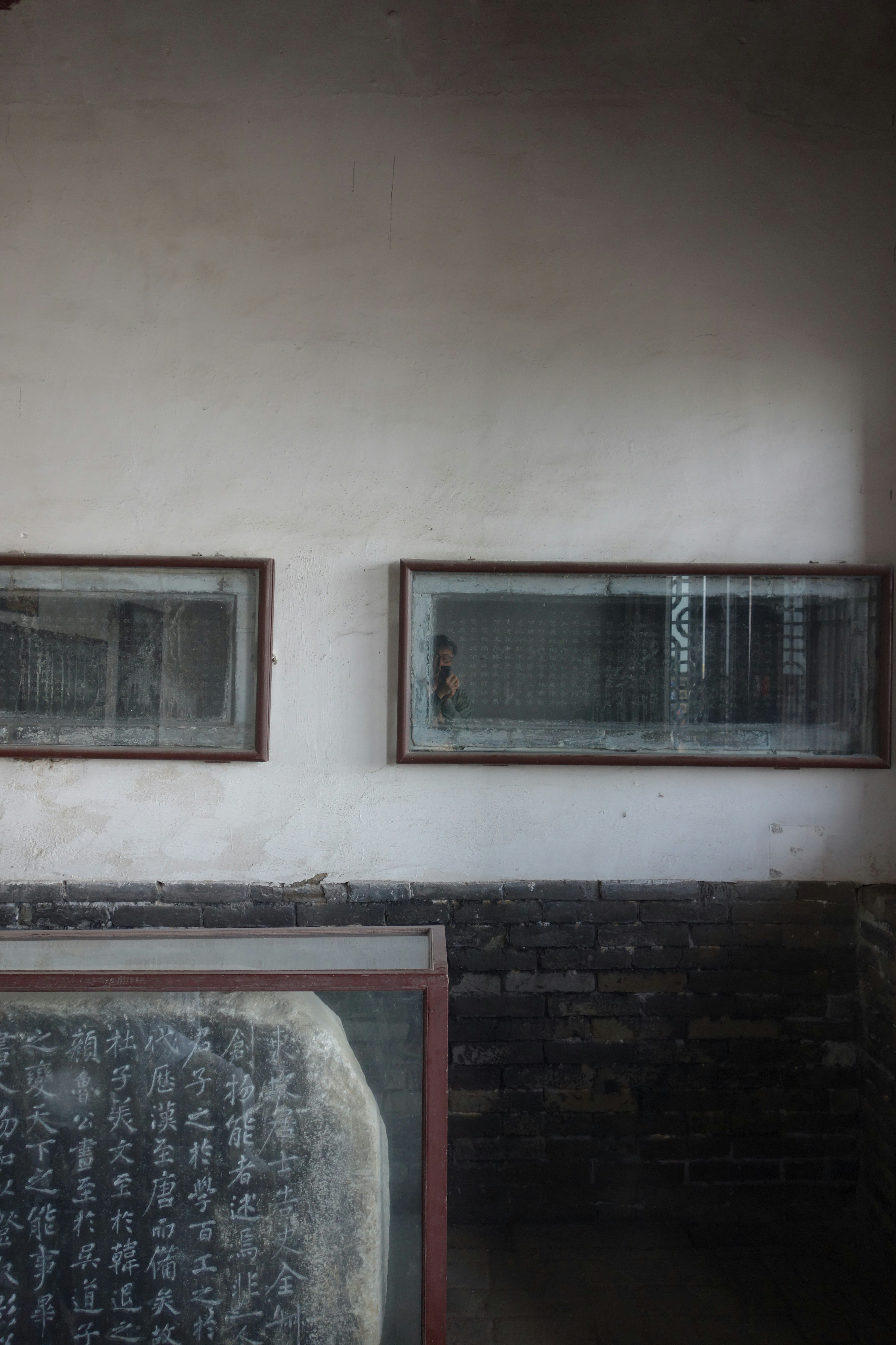 Echoes of Silence: Framed Windows in a Weathered Wall