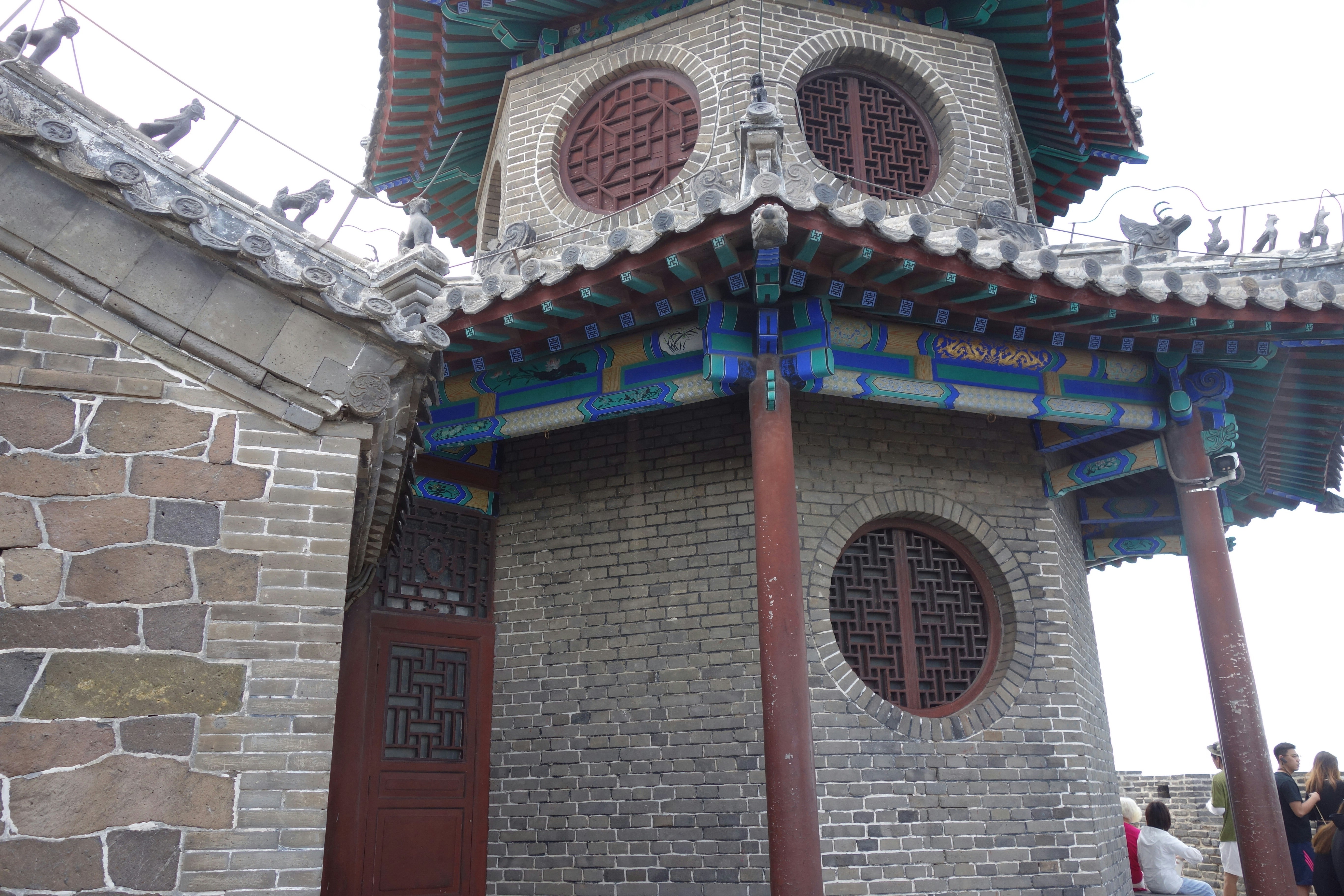 Stone Pagoda with Red Door under Carved Rooflines