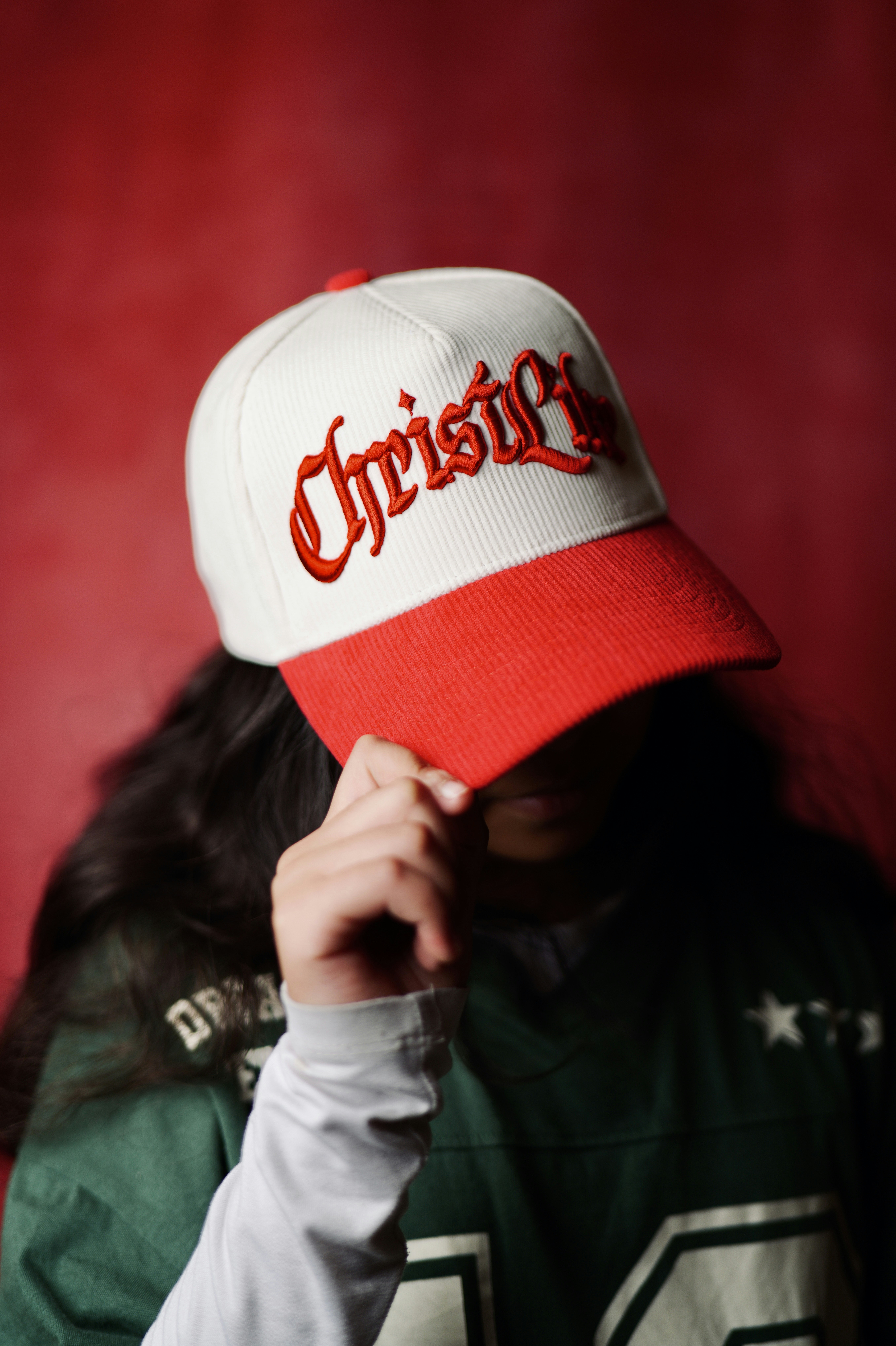 Cap and Confidence: A Hoodie Hero in Red Brim