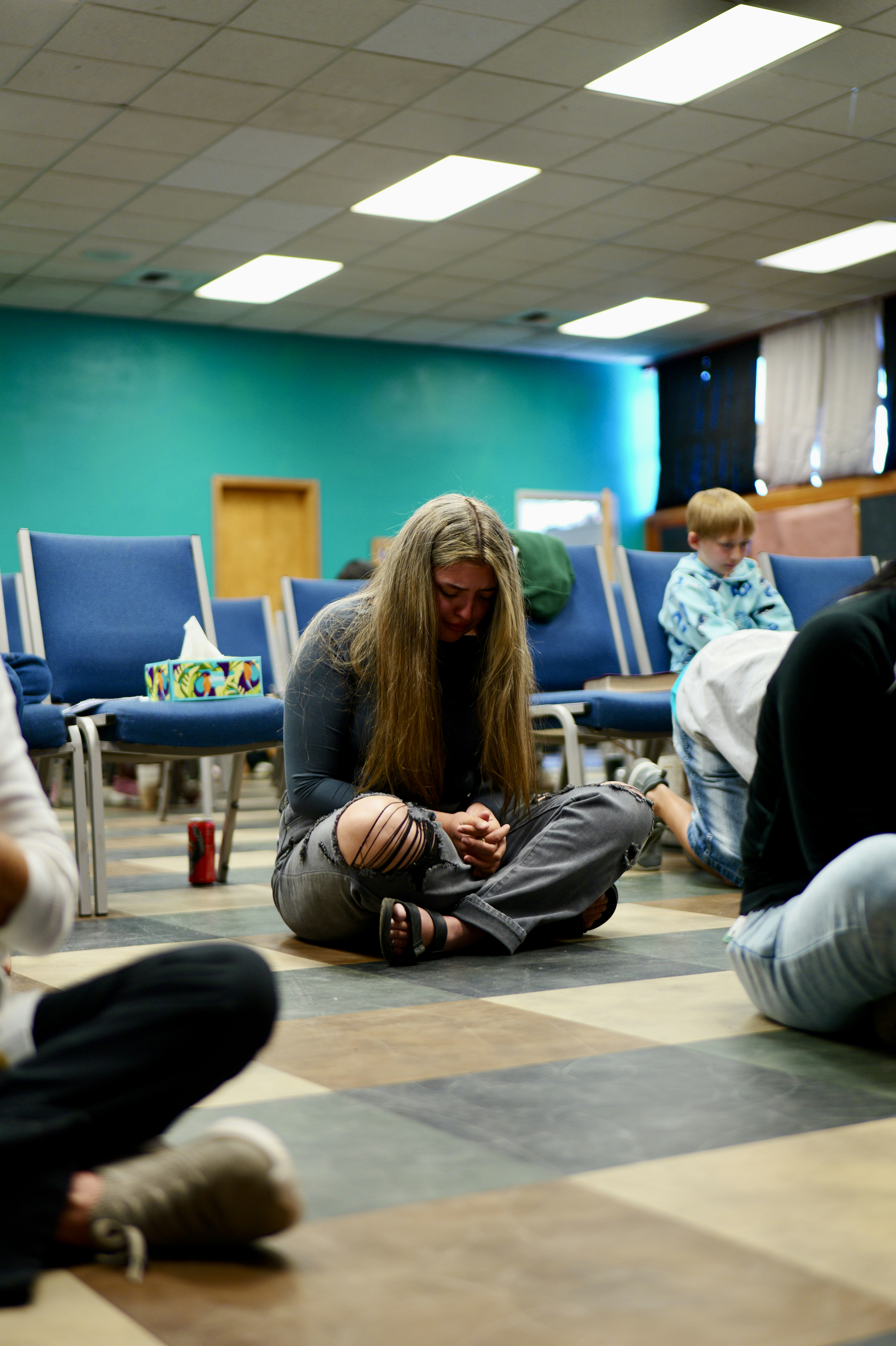 Center Stage in the Hall: A Quiet Moment on a Schoolroom Floor