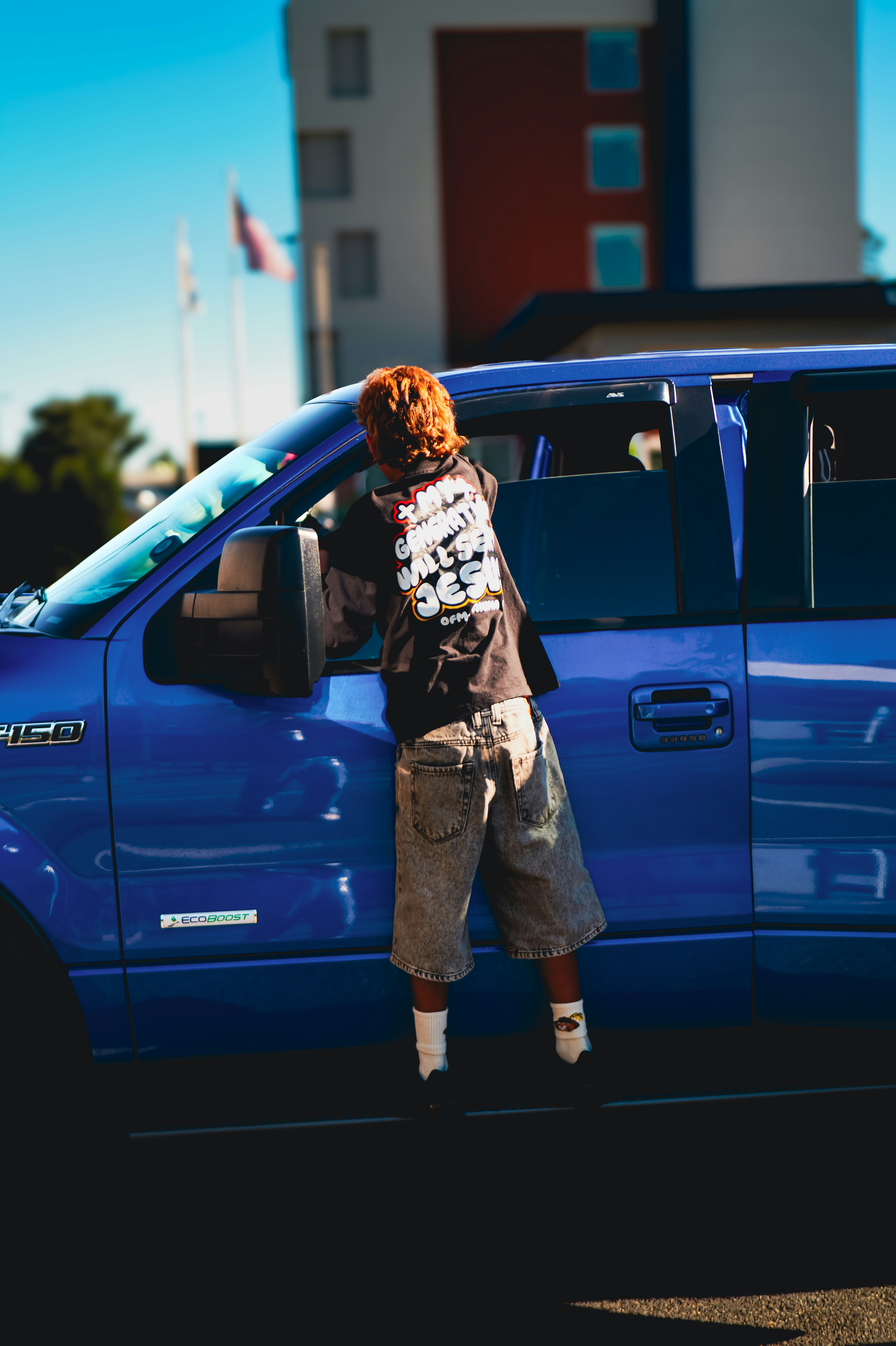 Hands on the Blue Giant: A Portrait at Truck Door