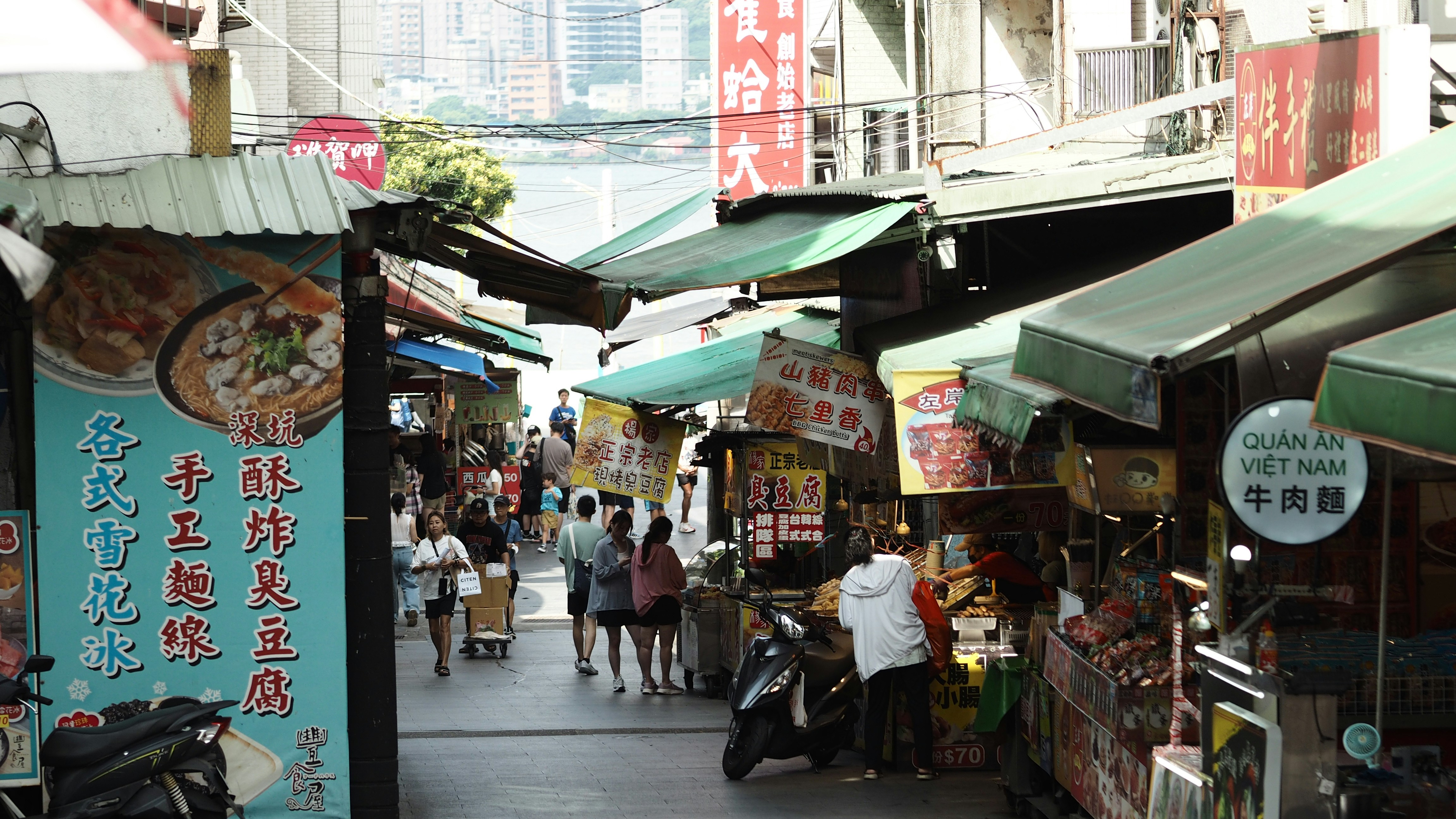 Market Street Corridor: People, Stalls, and Colorful Banners