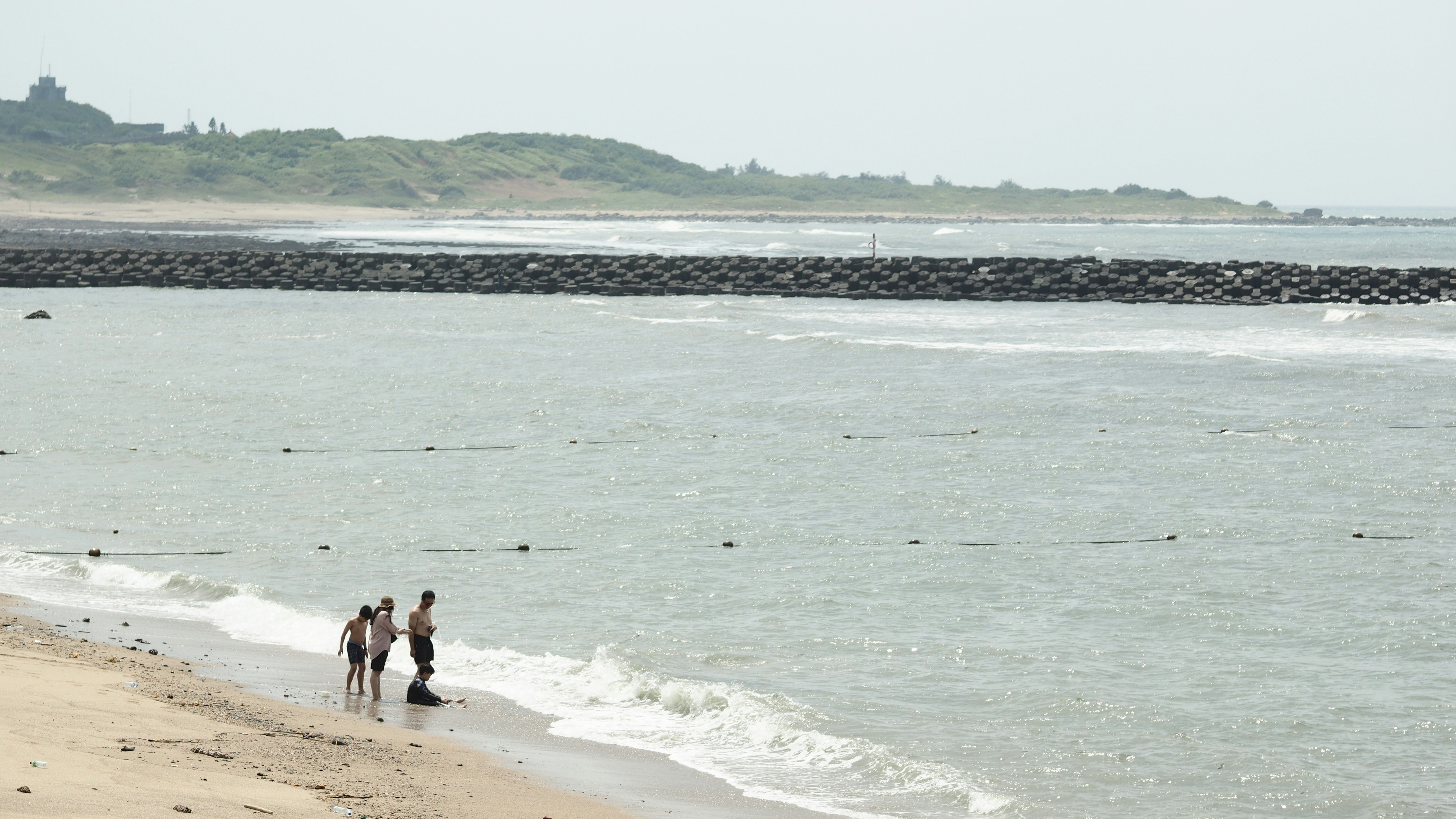 Two Figures at the Edge of the Sea
