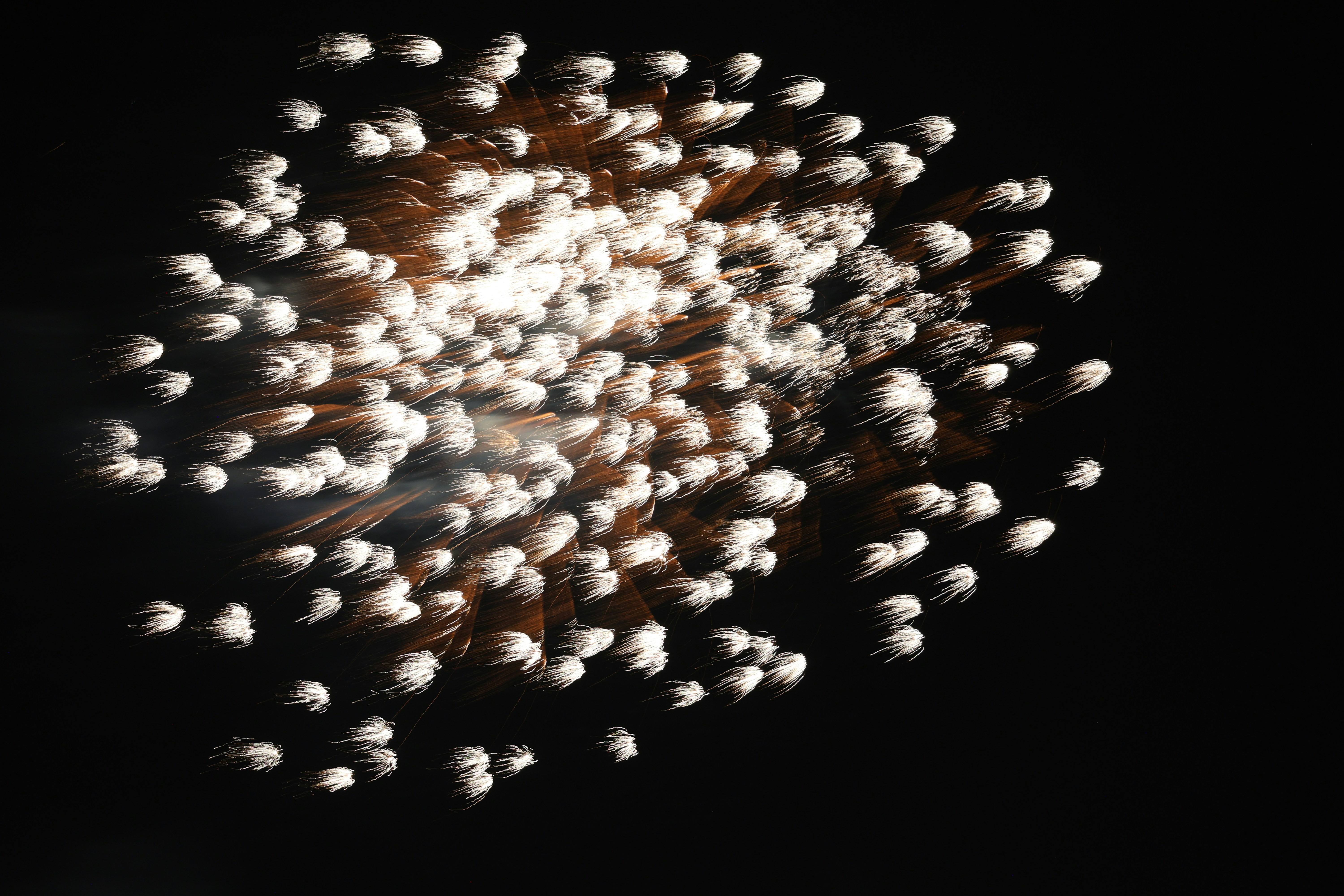 Firework Bloom: a radiant spiral of light against night