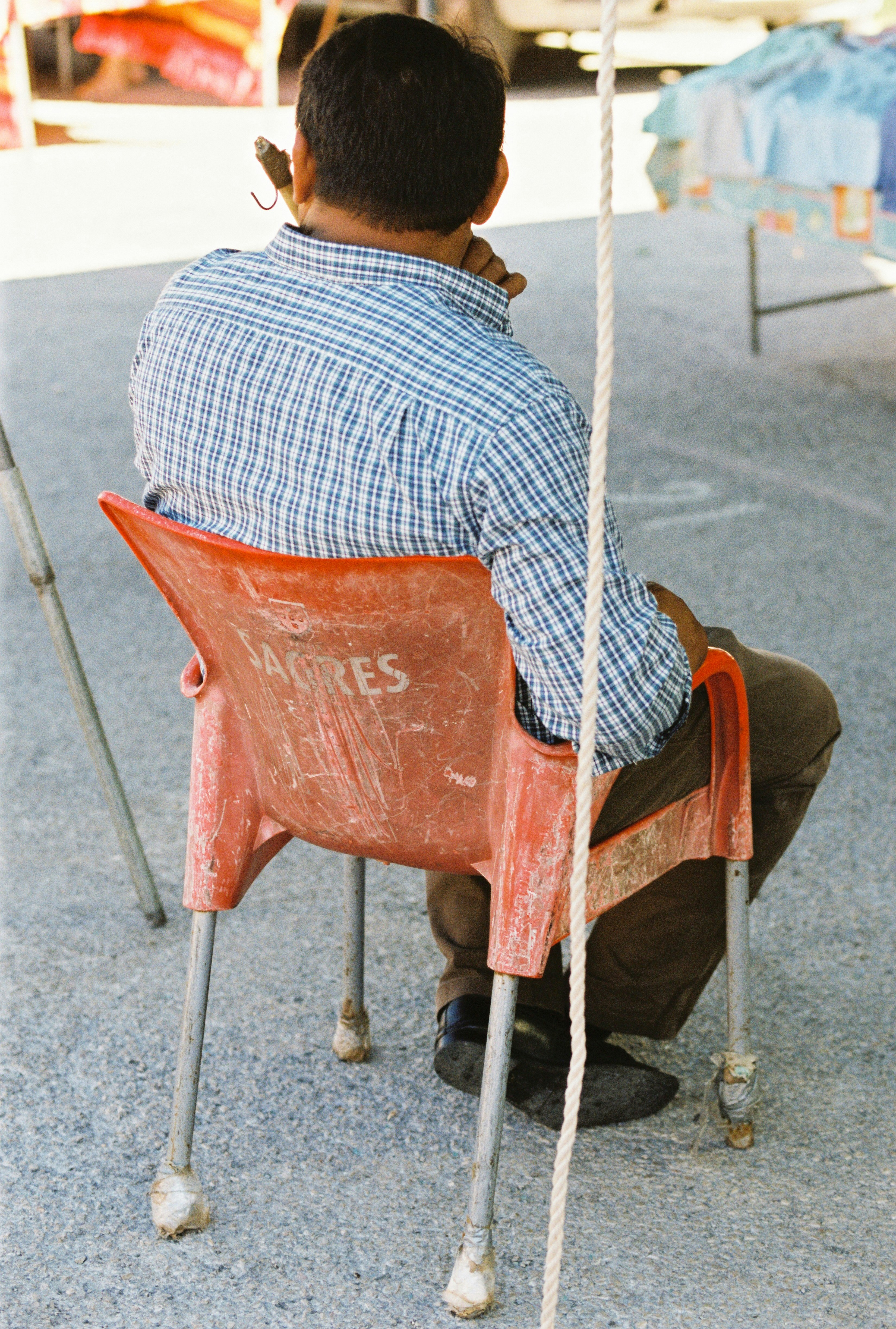 Rear View on a Sunlit Swing: A Quiet Handcrafted Moment