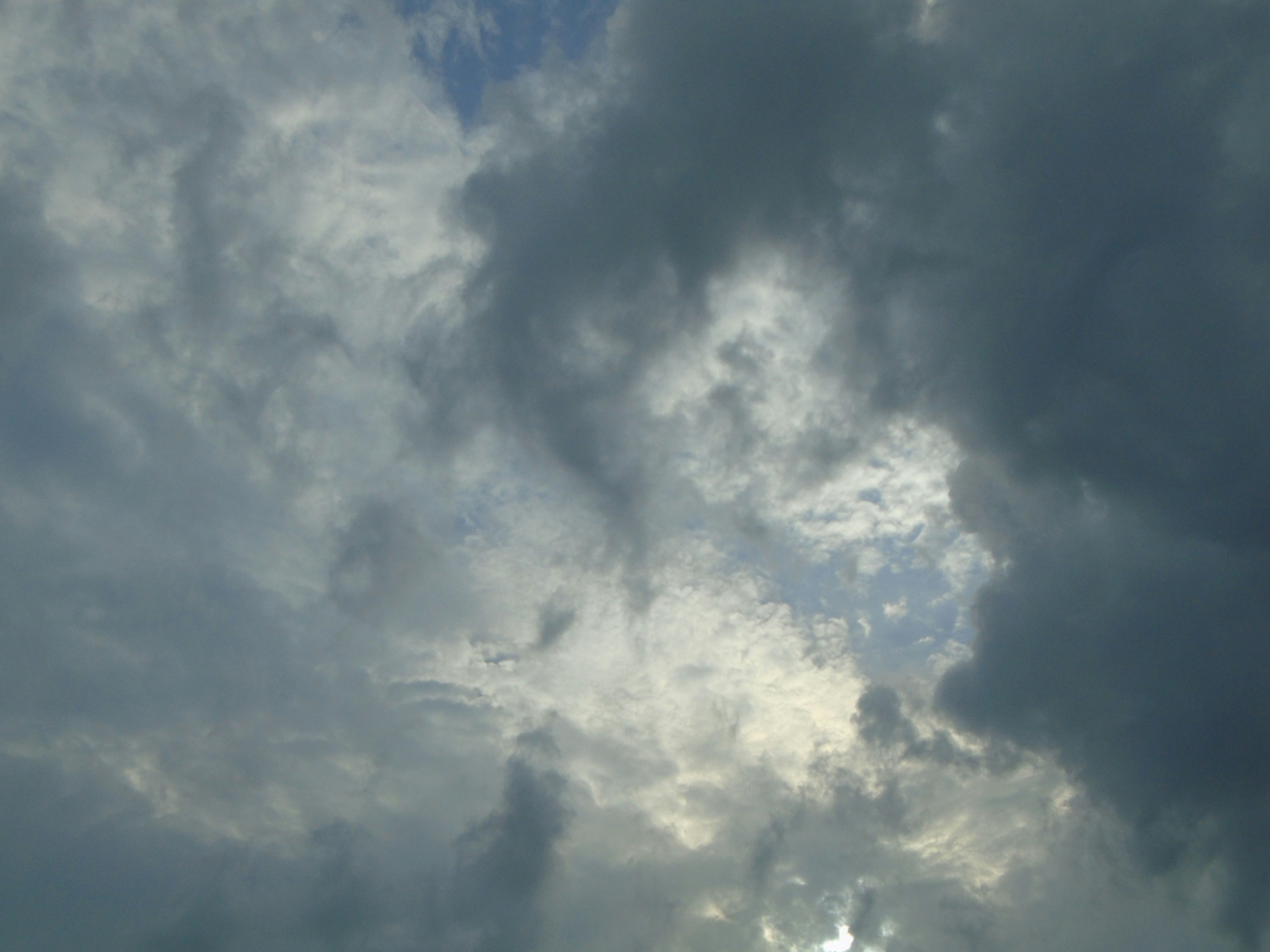 Sunlit Break in the Clouds over a Quiet Sky