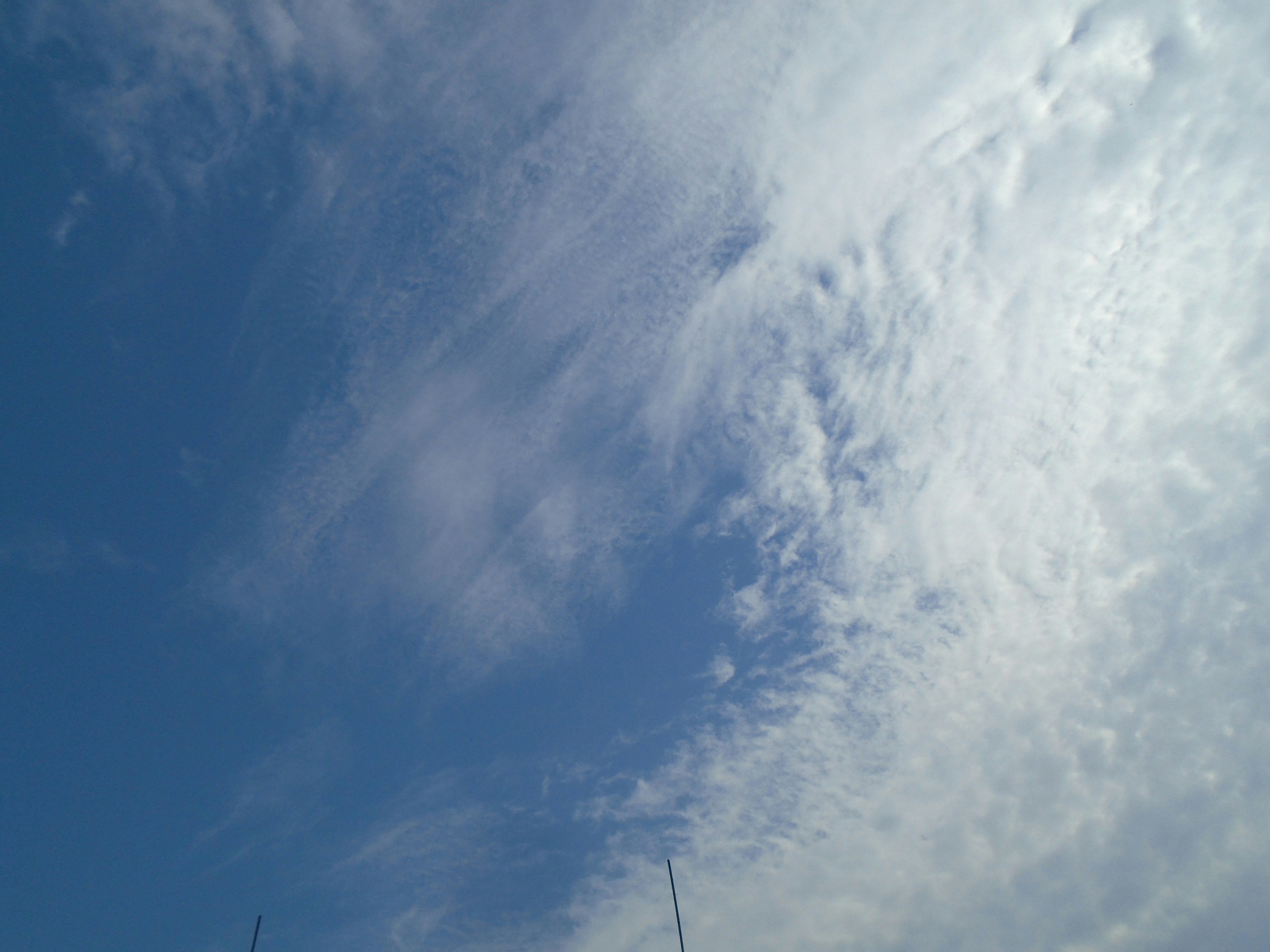 Cloud Brush over a Quiet Blue Sky
