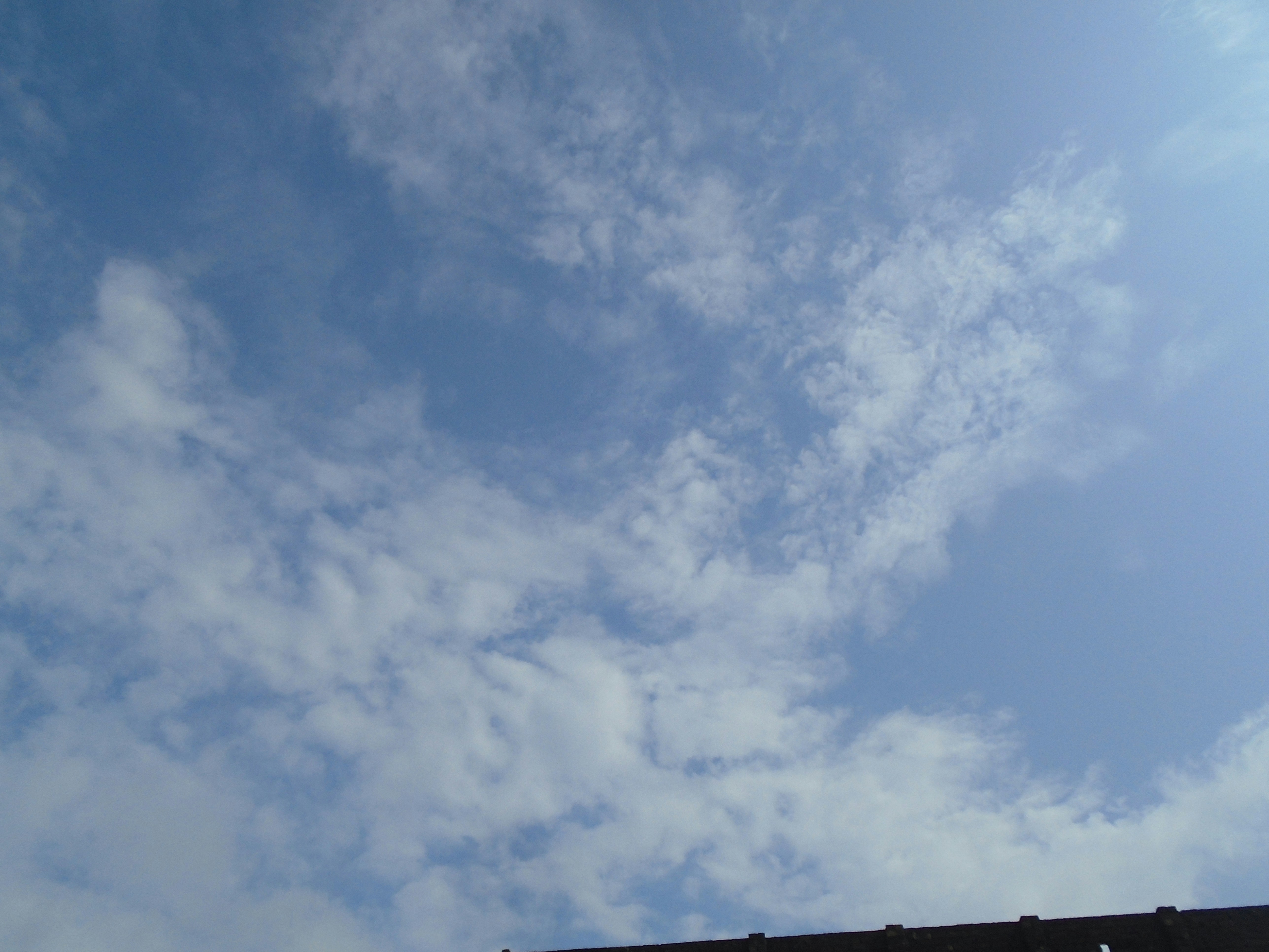 Cloudscape over a Quiet Rooftop
