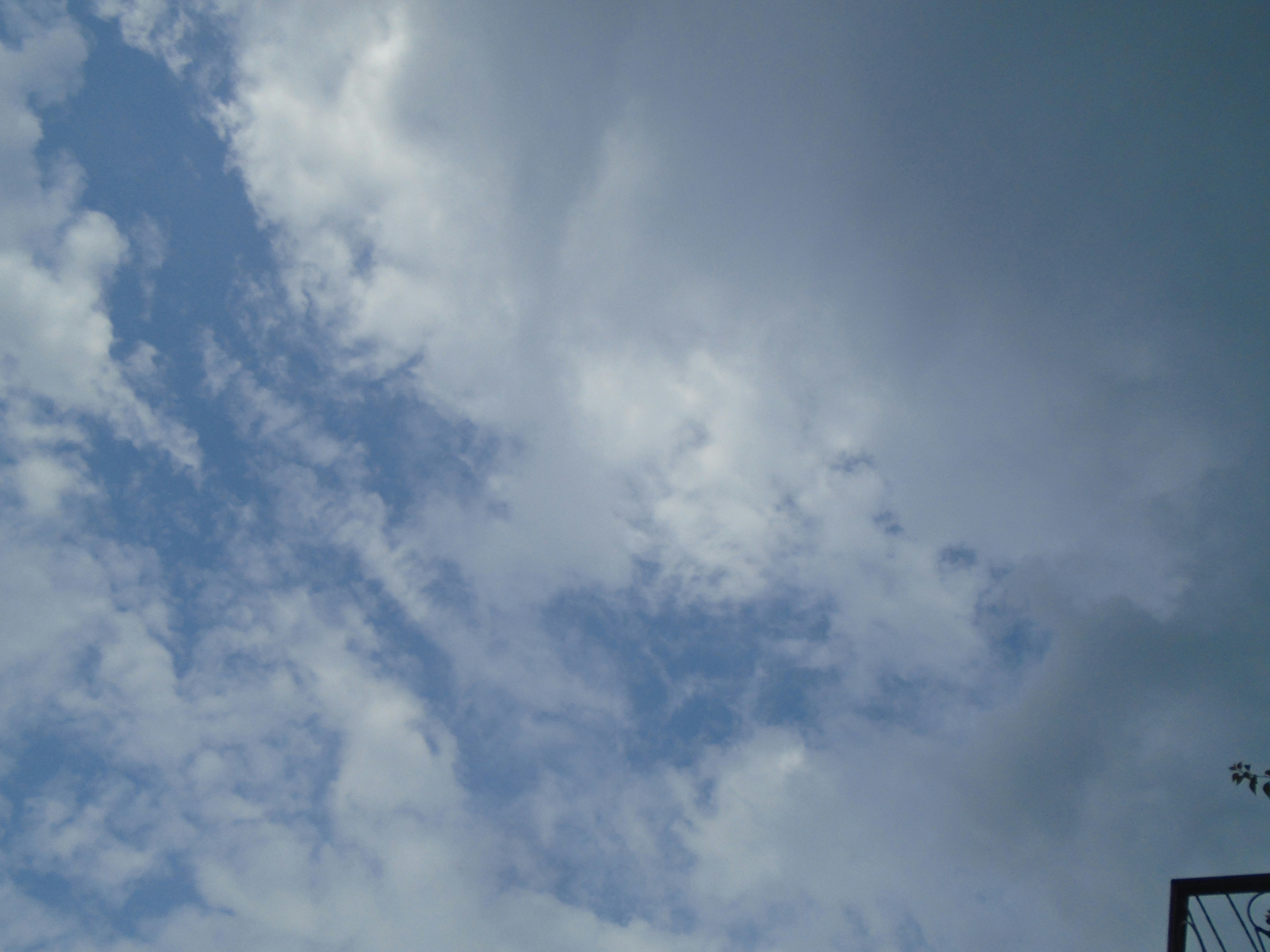 High Sky Ledger: A Patchwork of Blue and Cloud