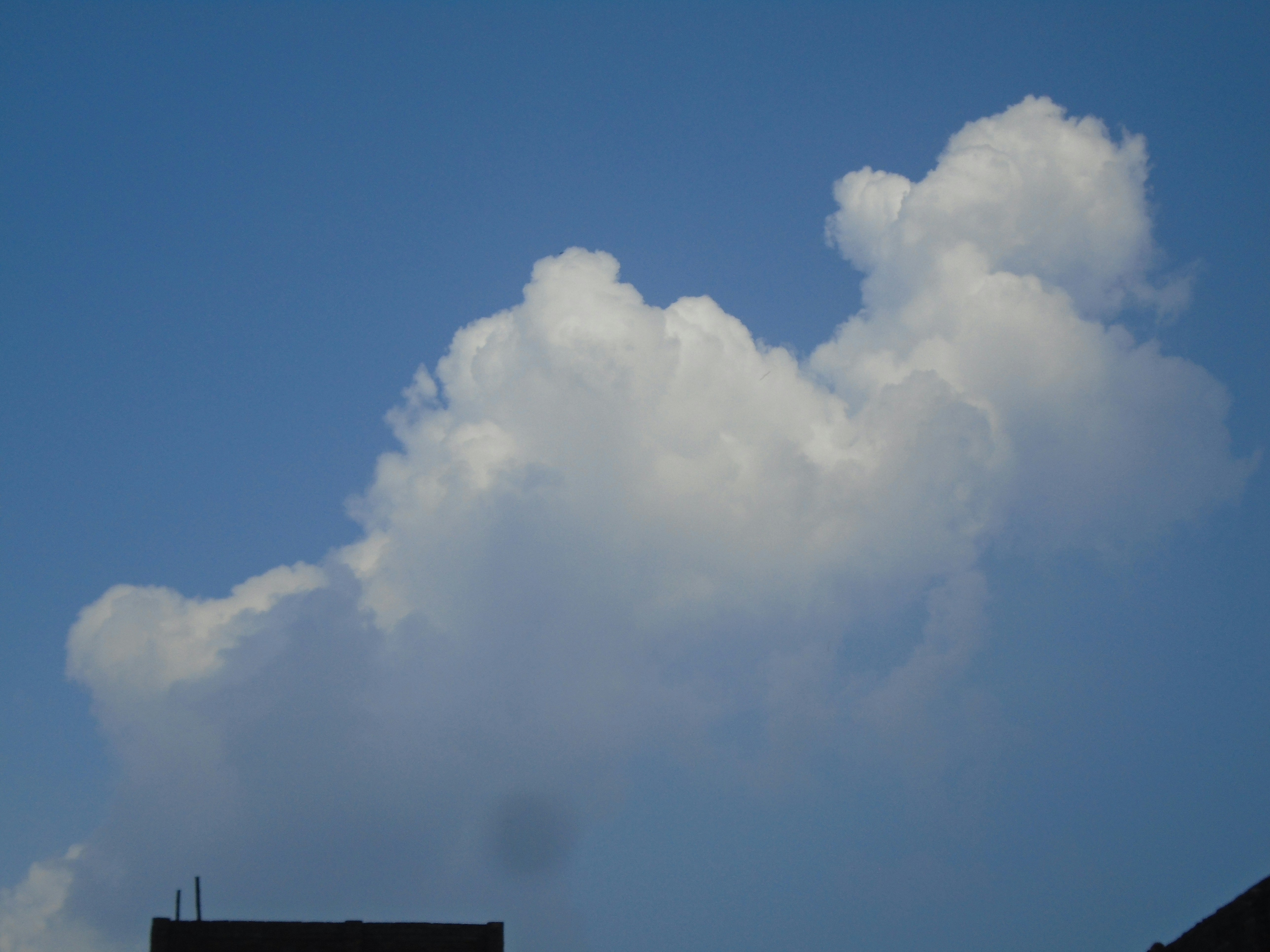 Cloud Cathedral in a Quiet Blue Expanse