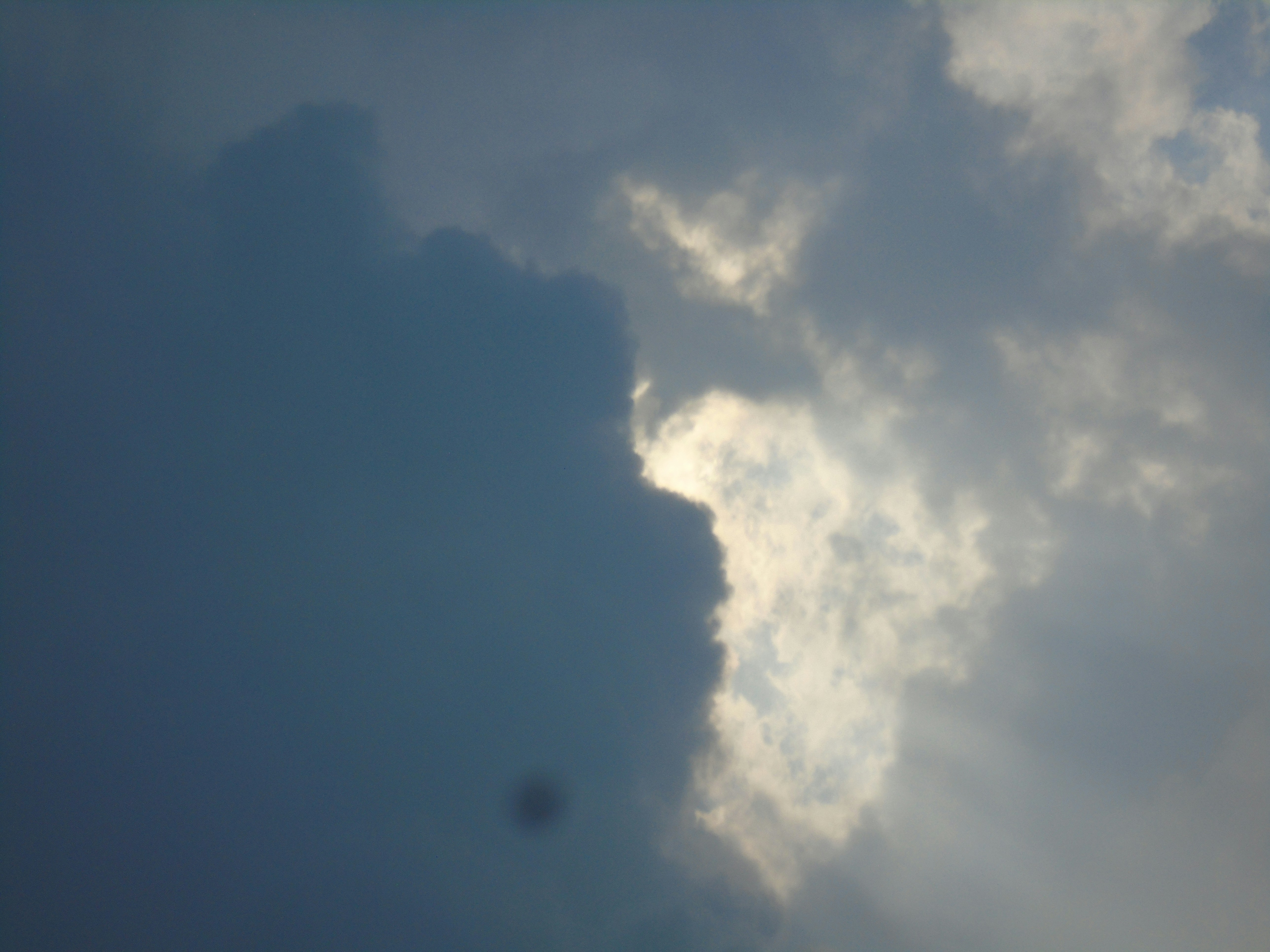 Contrast in the Clouds: Sunlight Piercing a Cloud Boundary