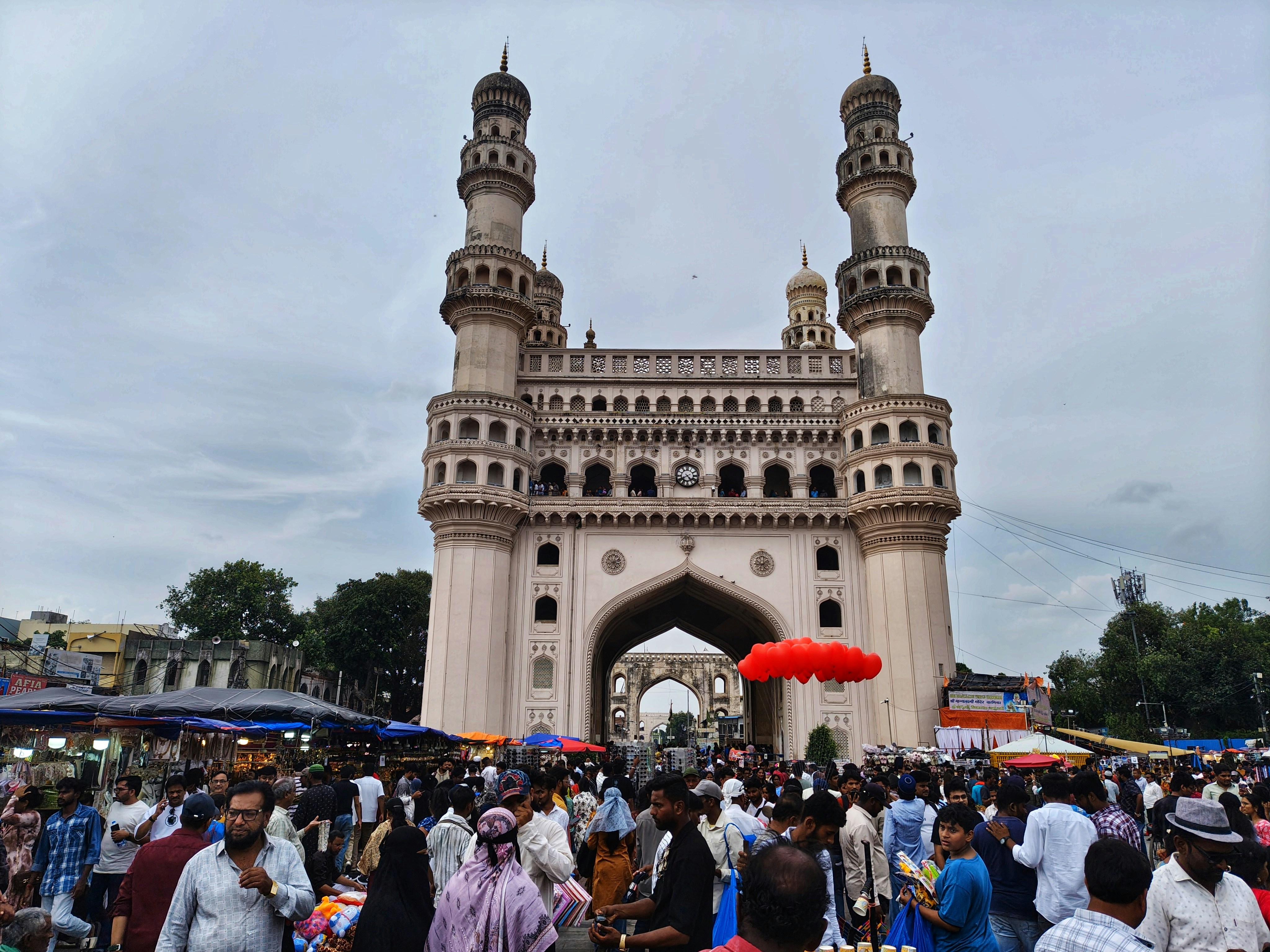 Archway of Celebration: Grand Gateway Amid a Sea of People