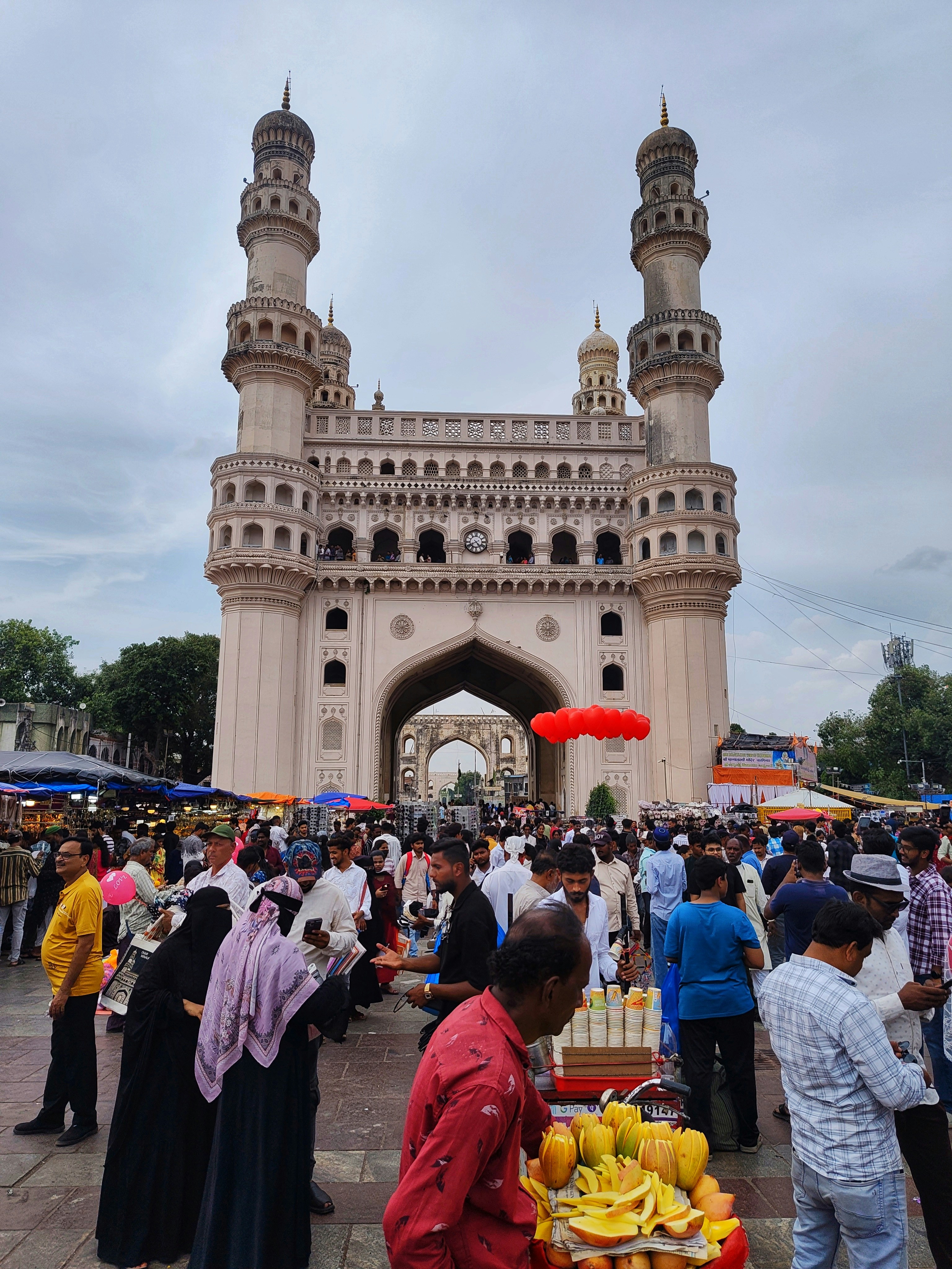 The Charismatic Gateway: Crowds Gathering Under Charminar