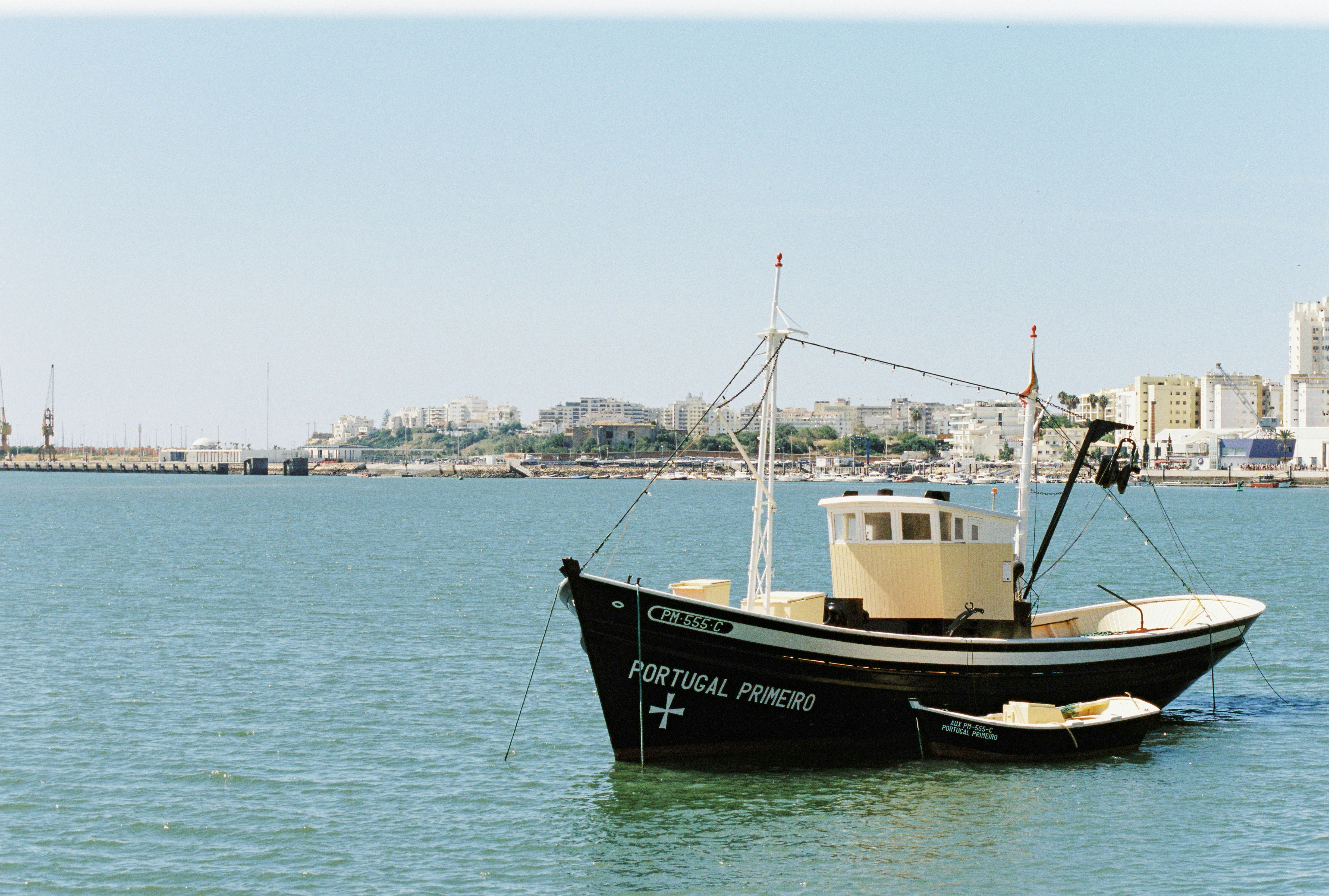Harbor Boat at Rest: A Sturdy Vessel Anchored in Calm Seas