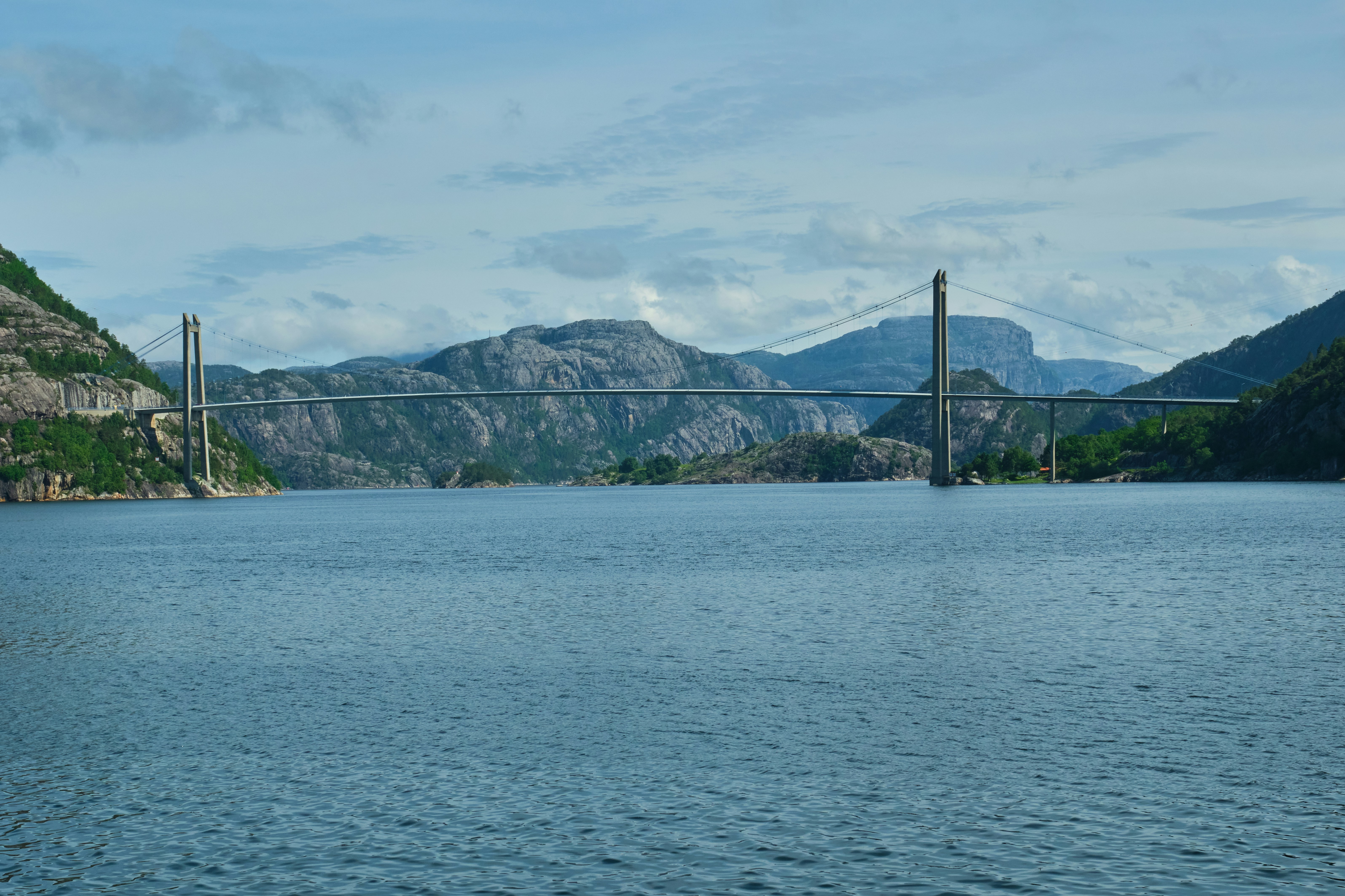 Span Across Blue Silence: A Mountain Bridge Over Calm Fjord
