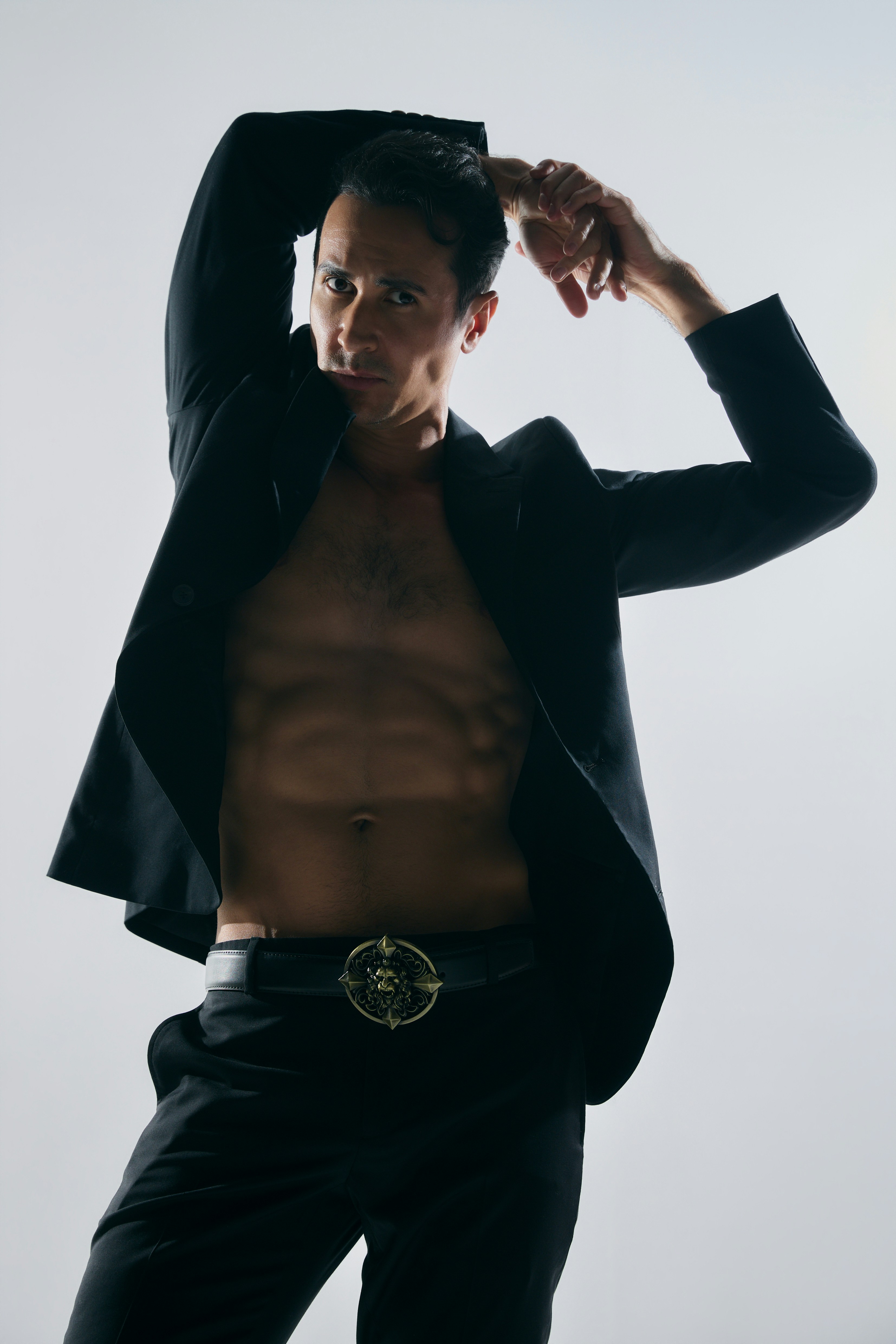 Midnight Flex: A Confident Pose with Open Shirt and Leather Jacket