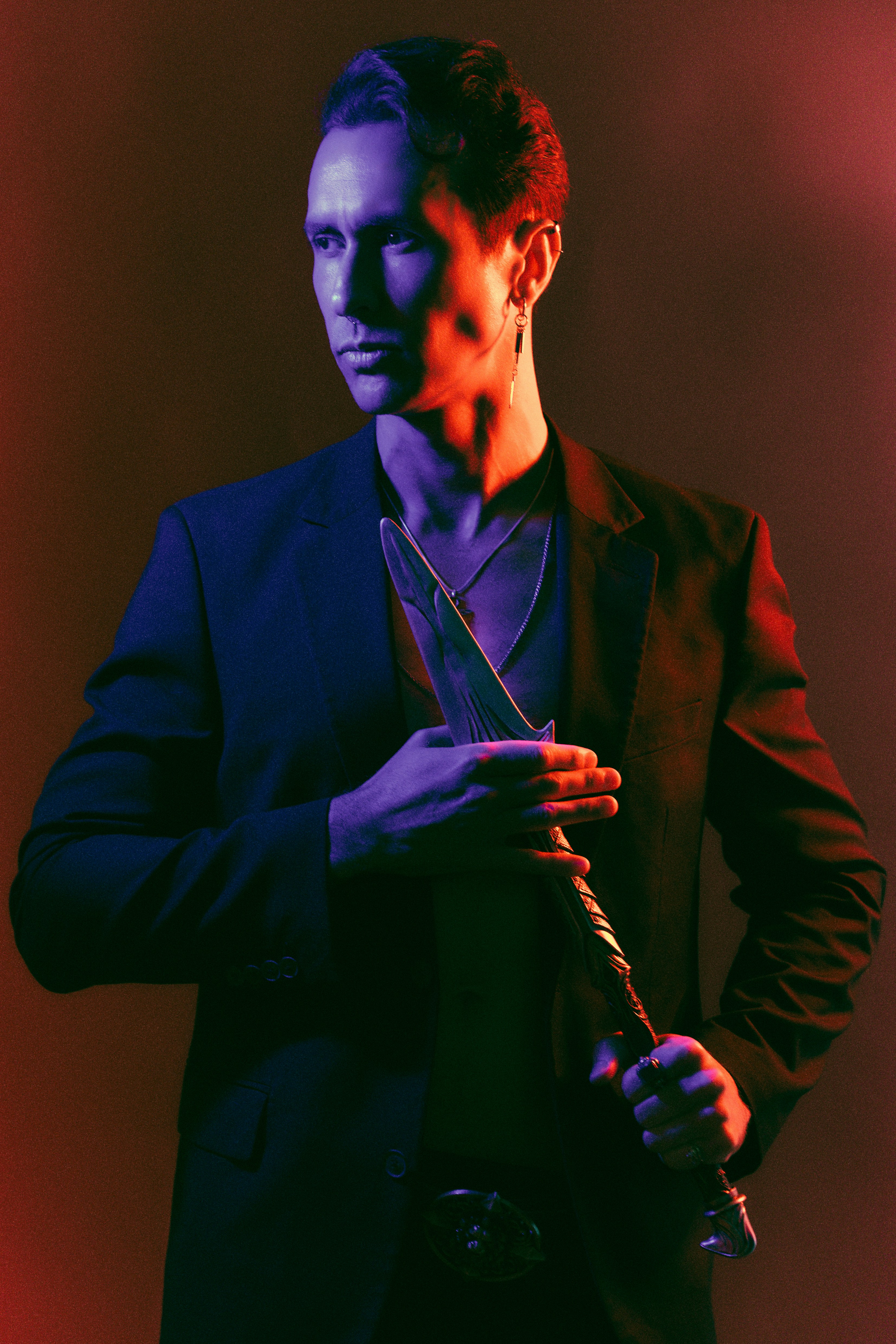 Shadowed Specter with a Dagger: A Portrait in Red and Blue