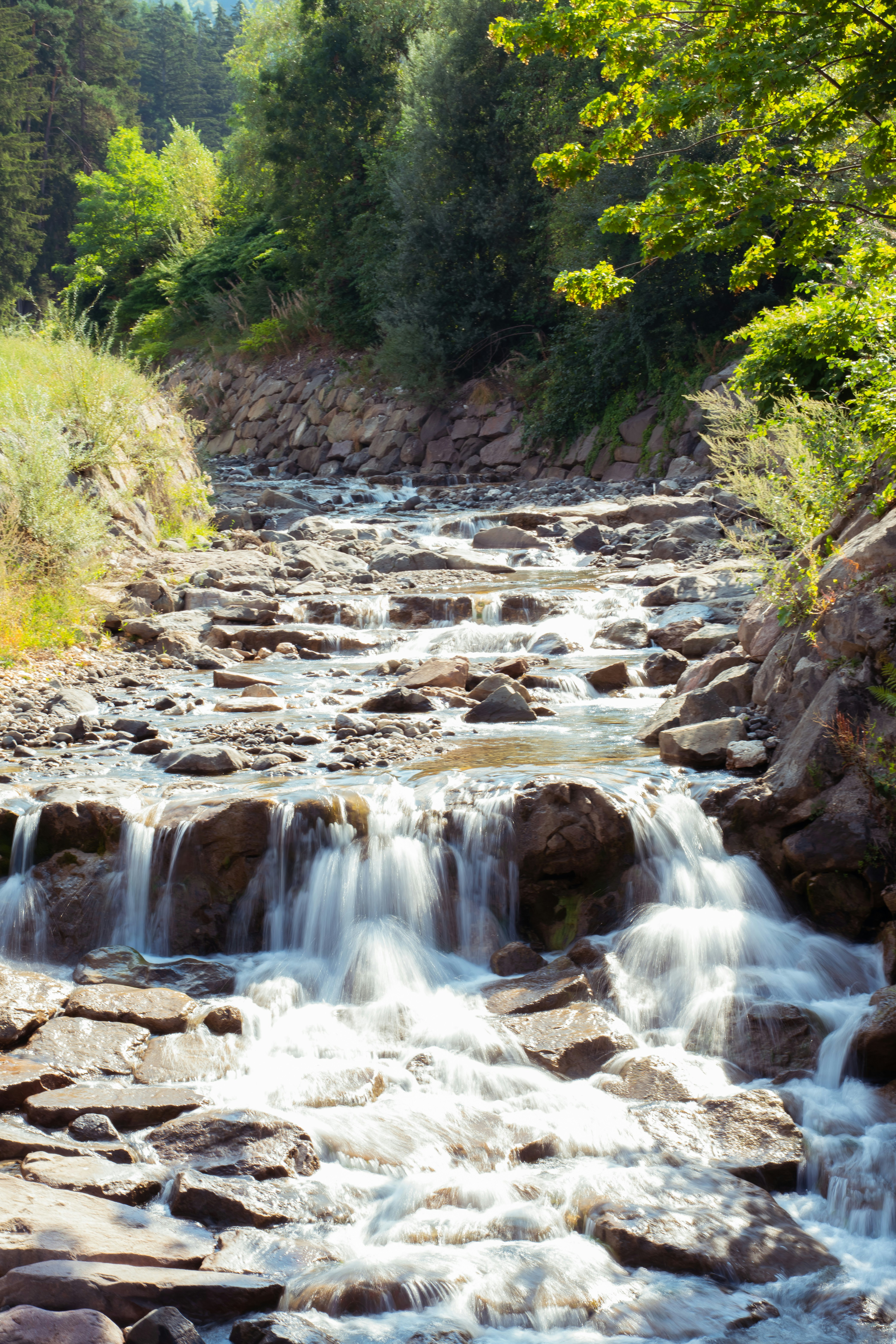 Rushing Cascade Through a Rocky Corridor