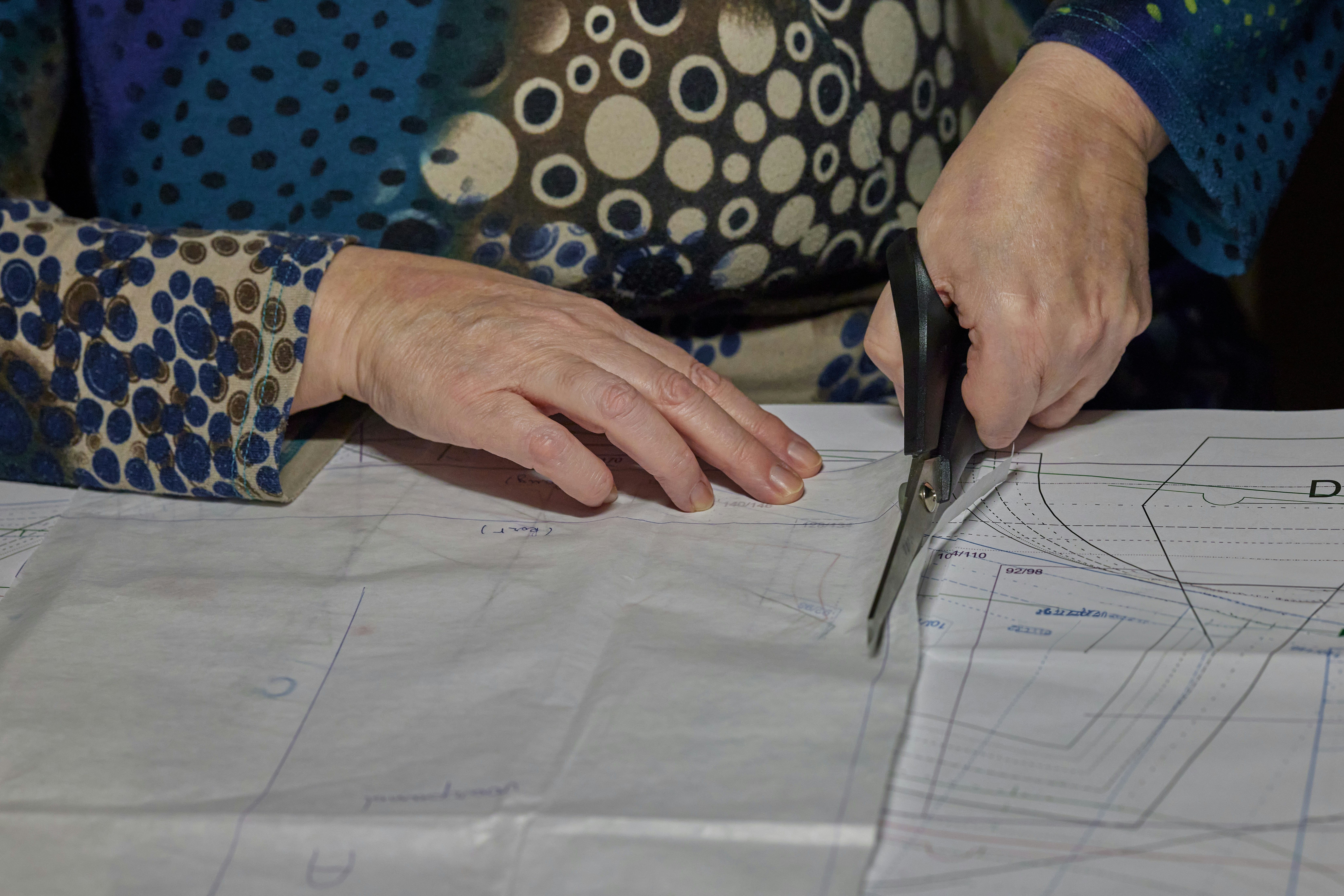 Hands at Work: Trimming the Lines of a Blueprint