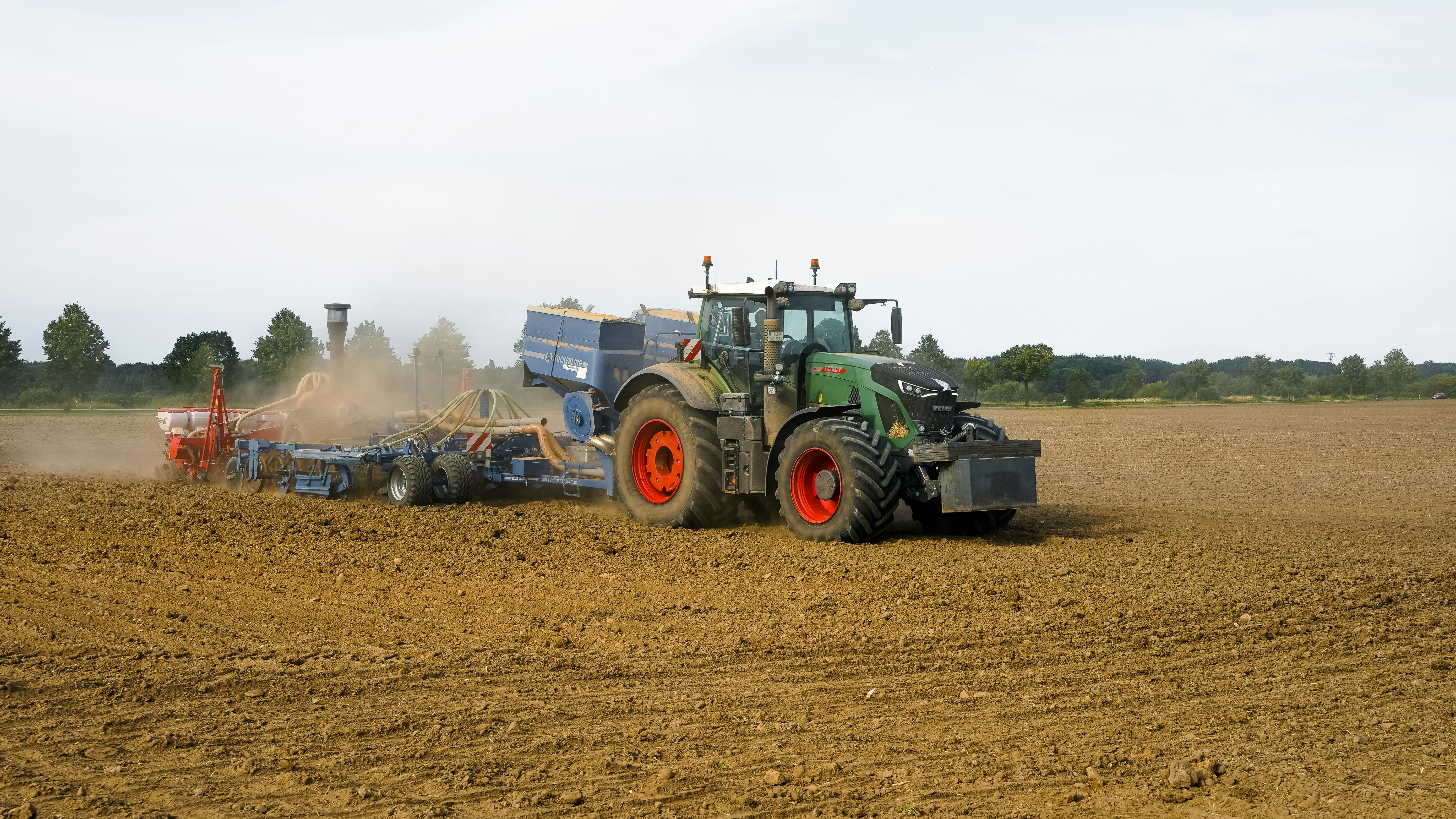 Midfield Workhorse: Tractor in Dusty Harvest