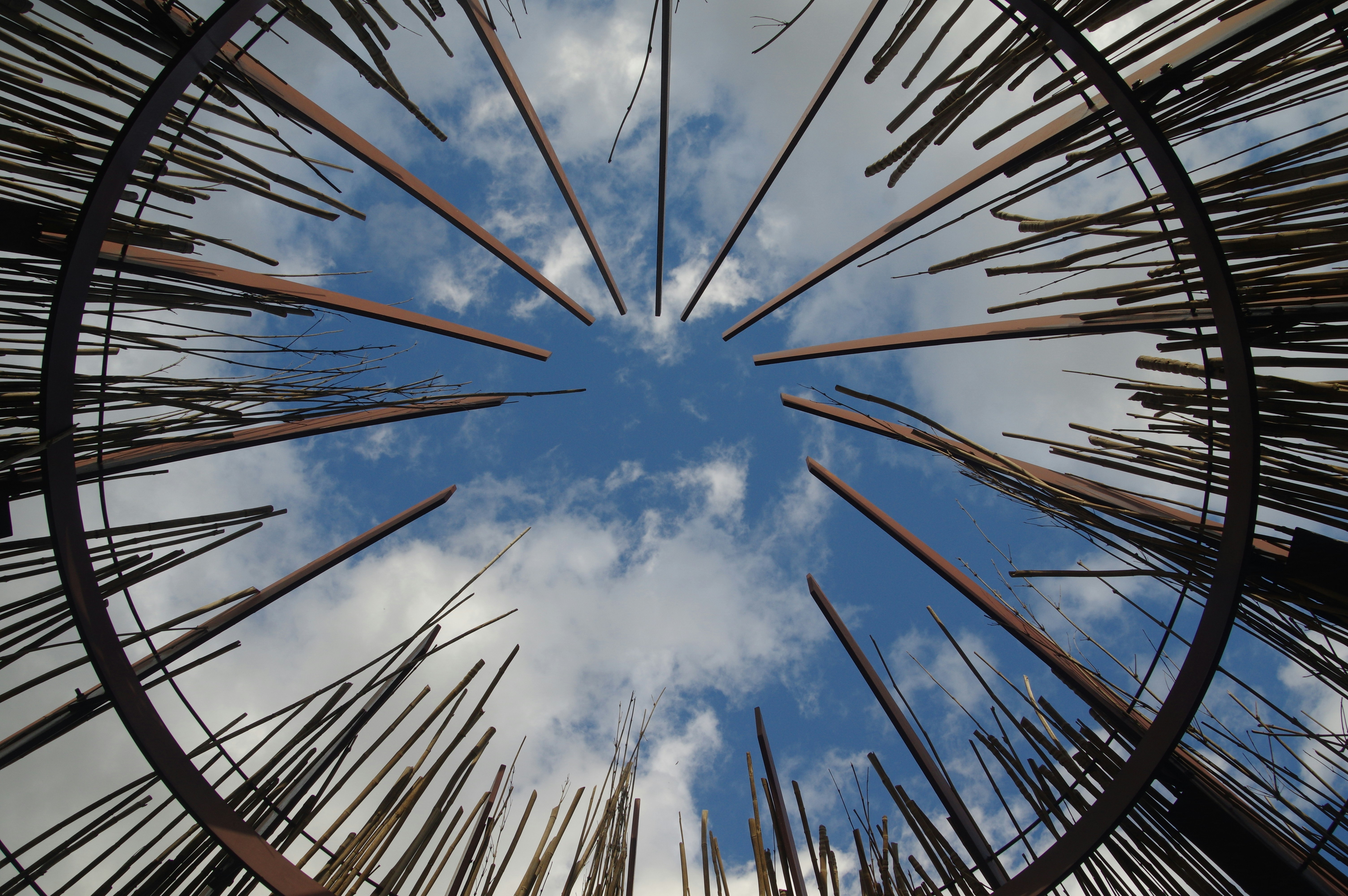 Circular Skyward: Steel Spokes Framing an Open Blue