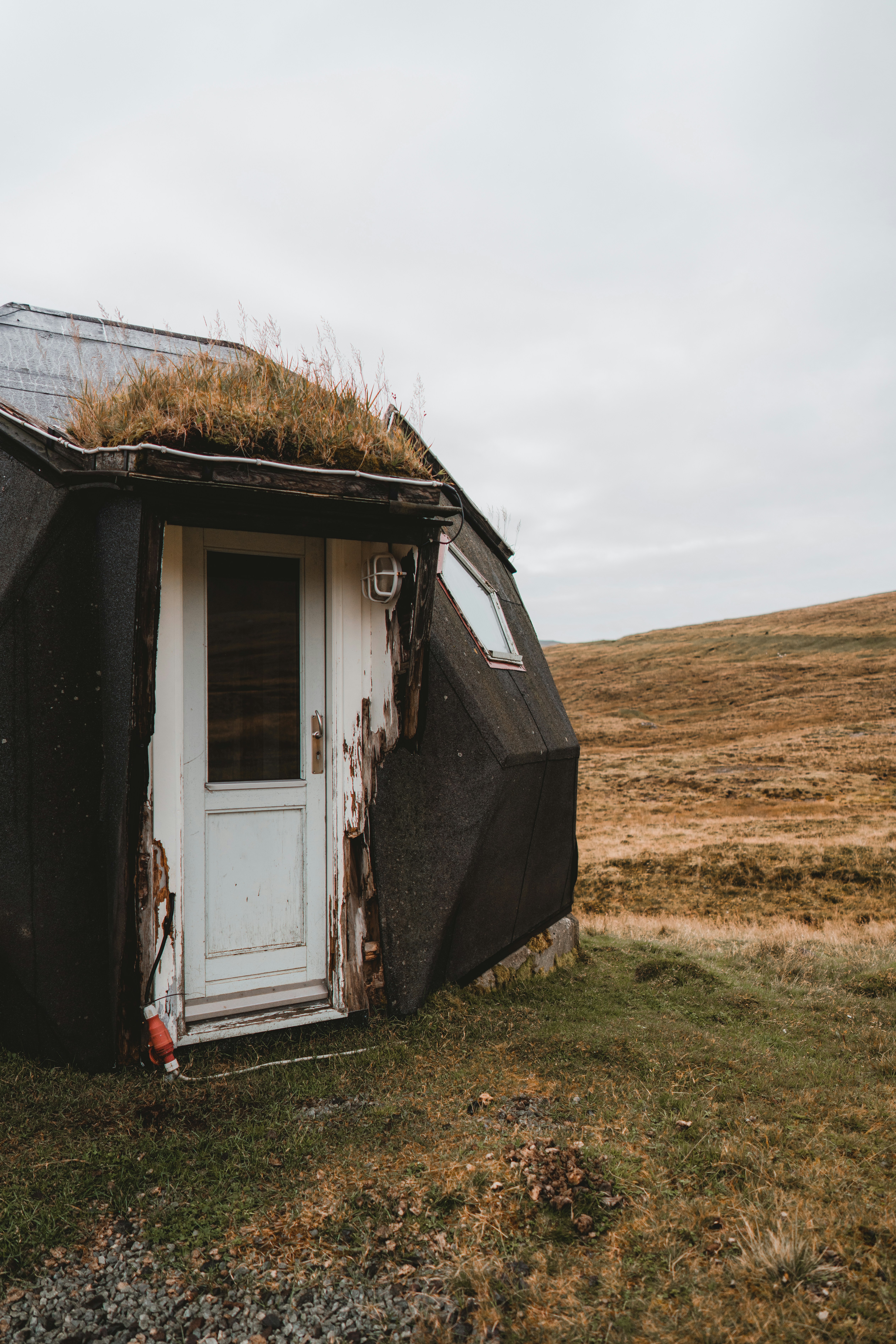 Weathered Cottage at the Edge of a Placid Moor