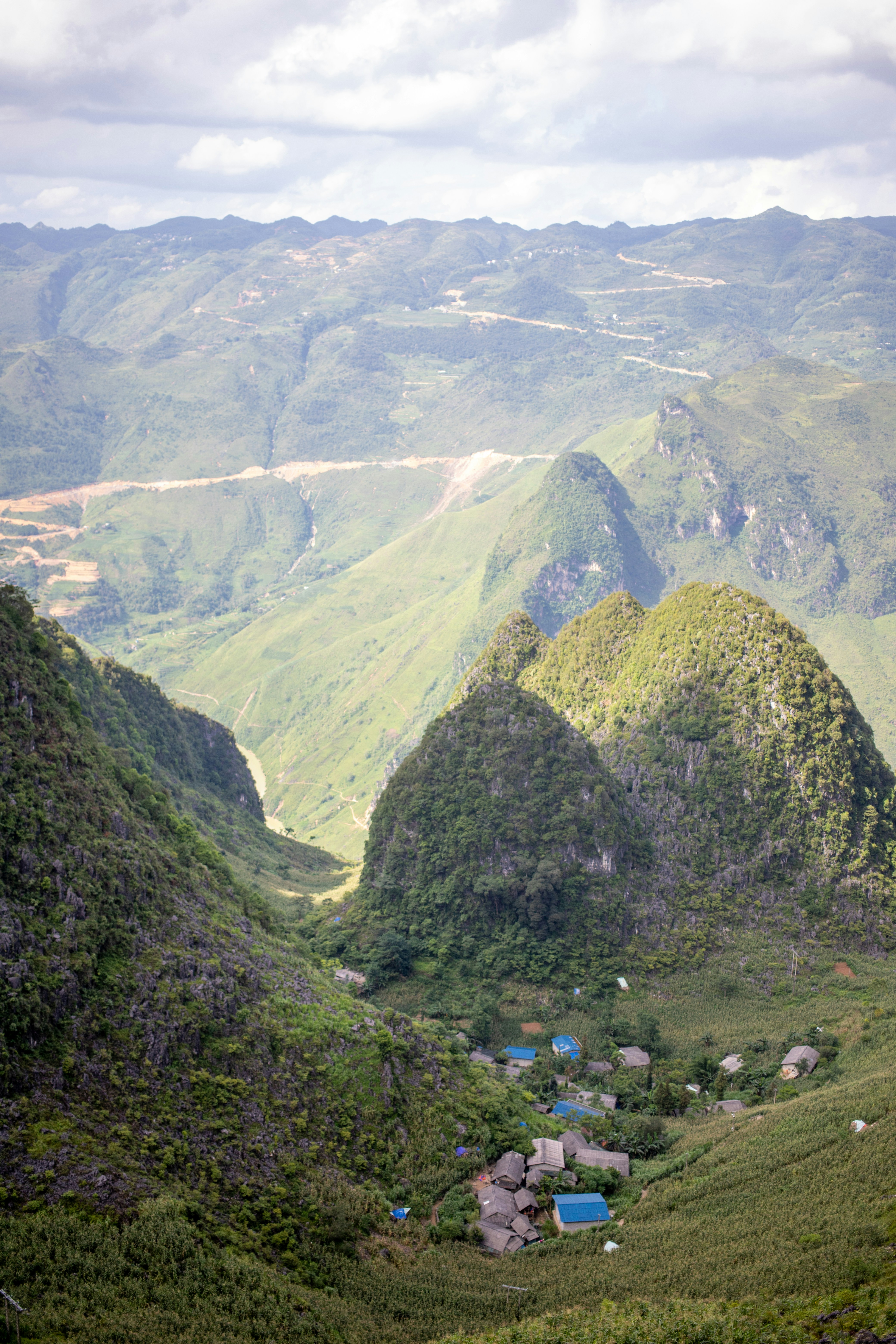 Limestone Carved Valleys and Village in a Lush Karst Basin