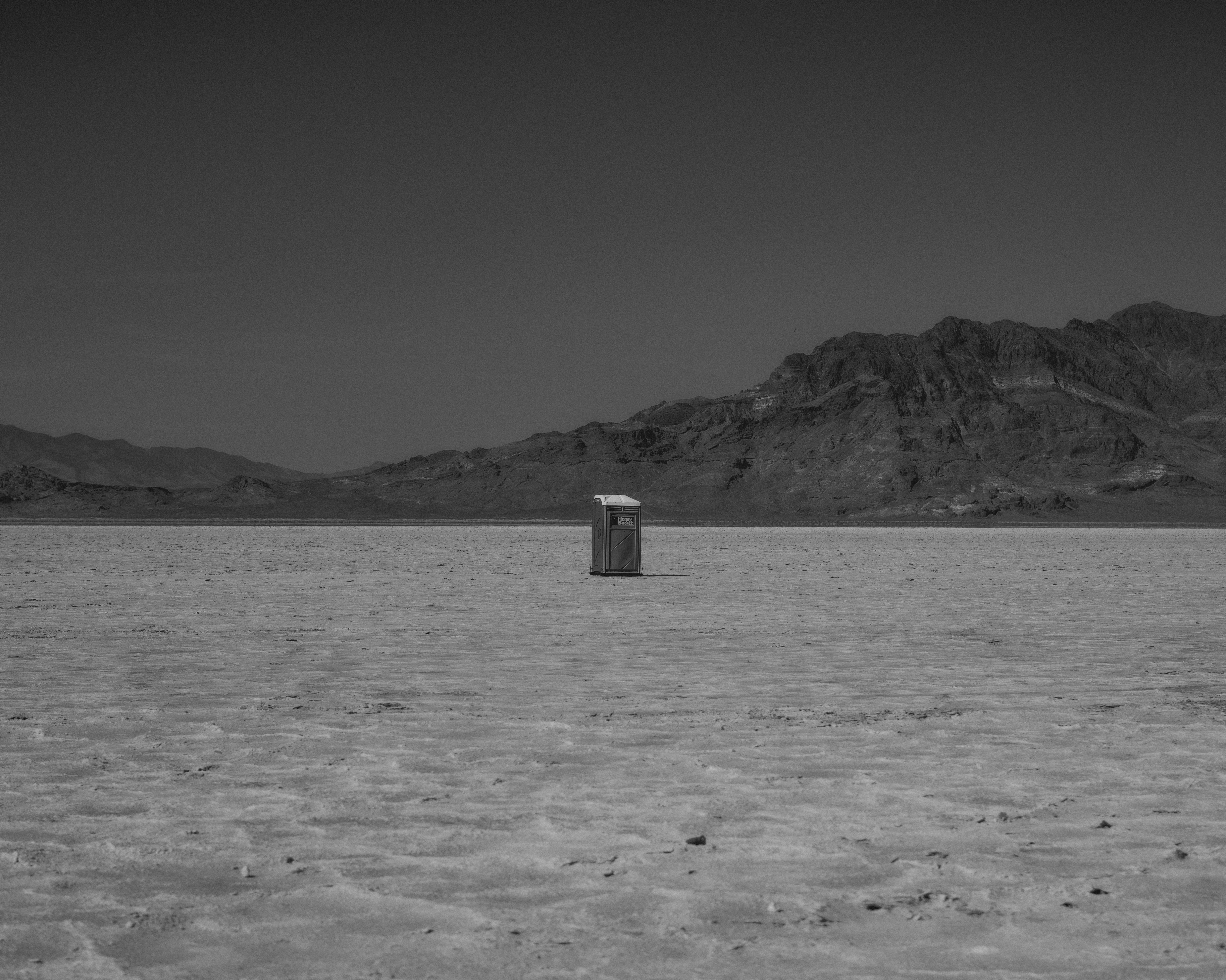  lone portable outpost in a salt-flat horizon