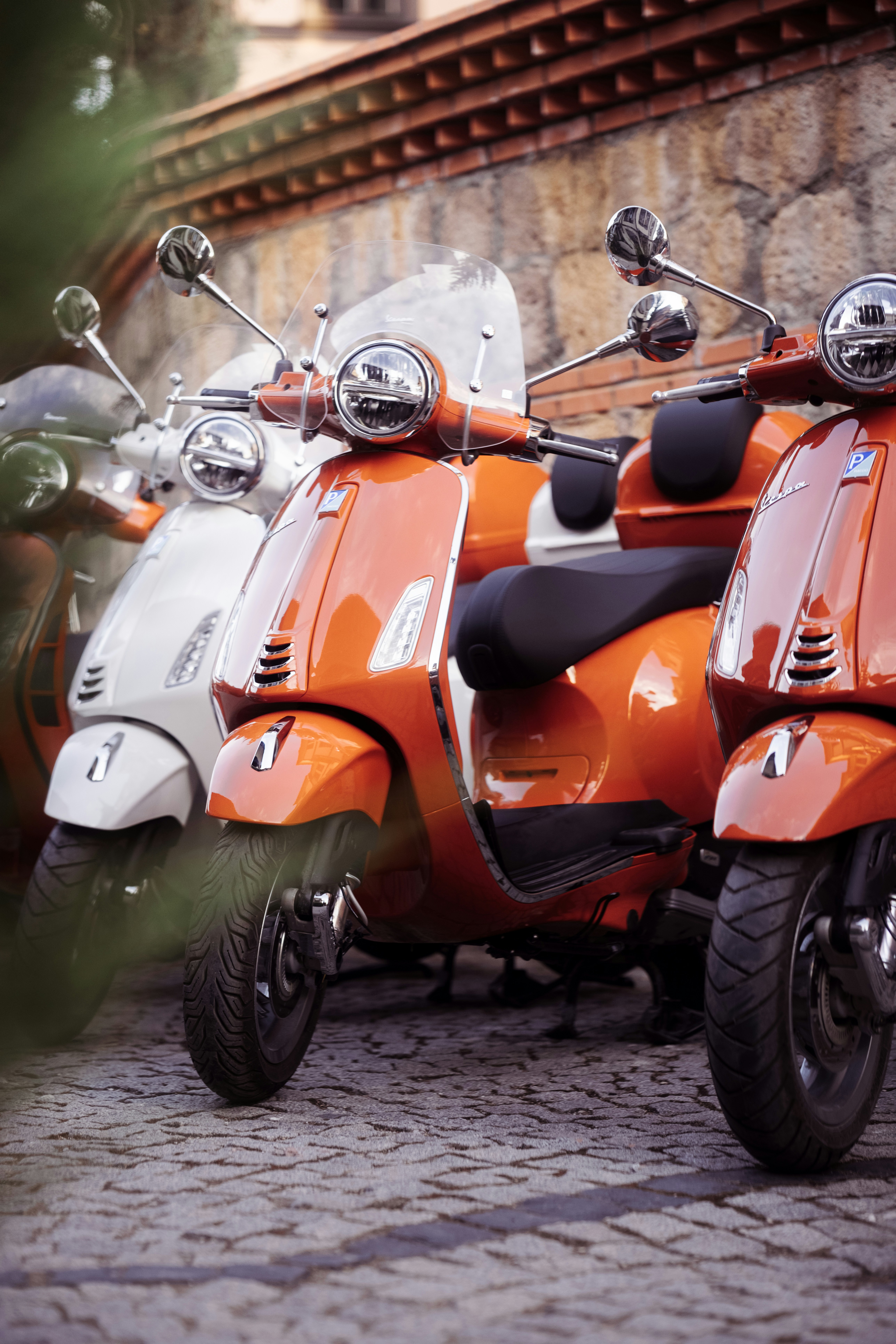 Orange Vespa Row: A Quiet Stand of Chrome and Color
