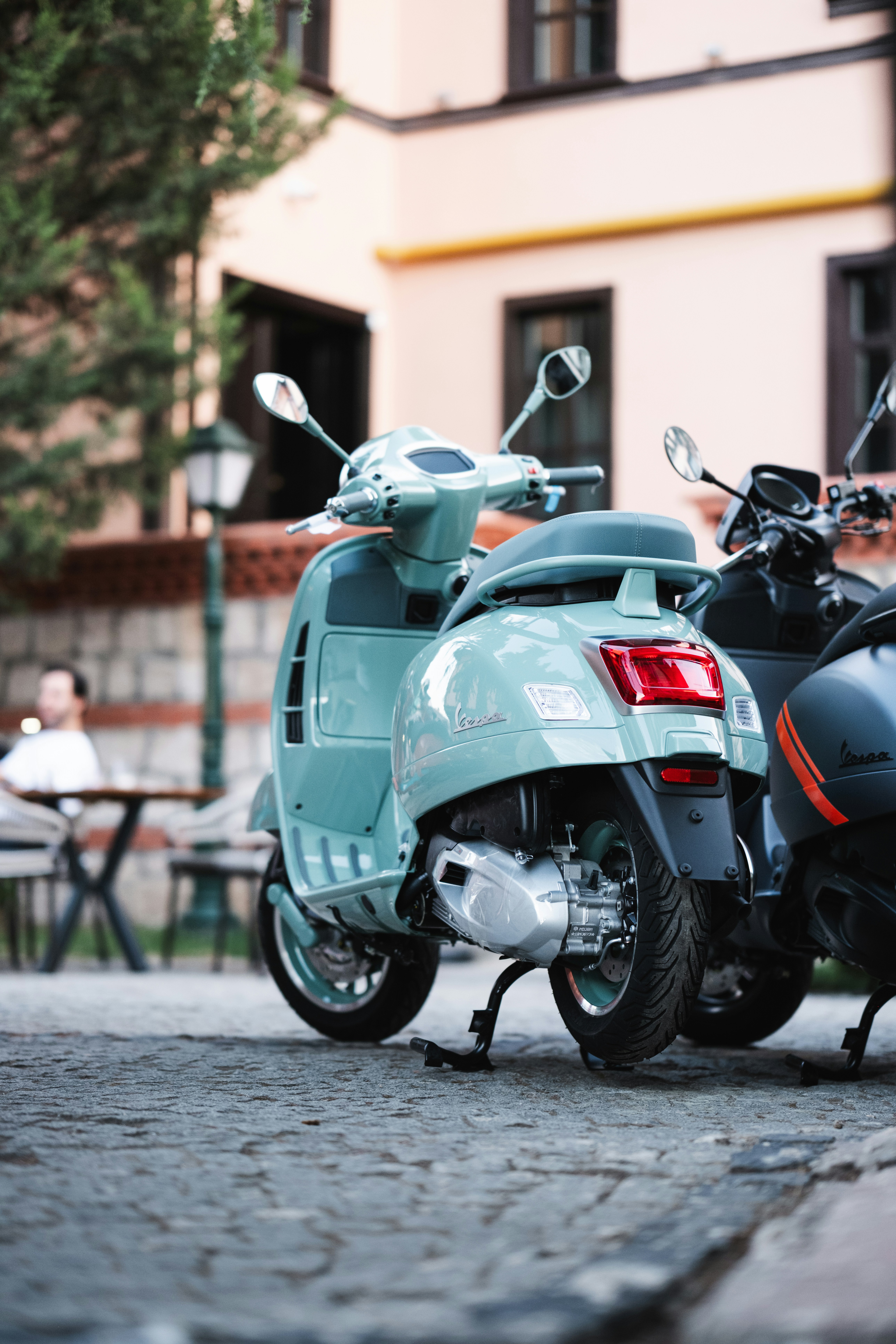 Pastel Vespa Parade: A Quiet Moment on the Cobblestones