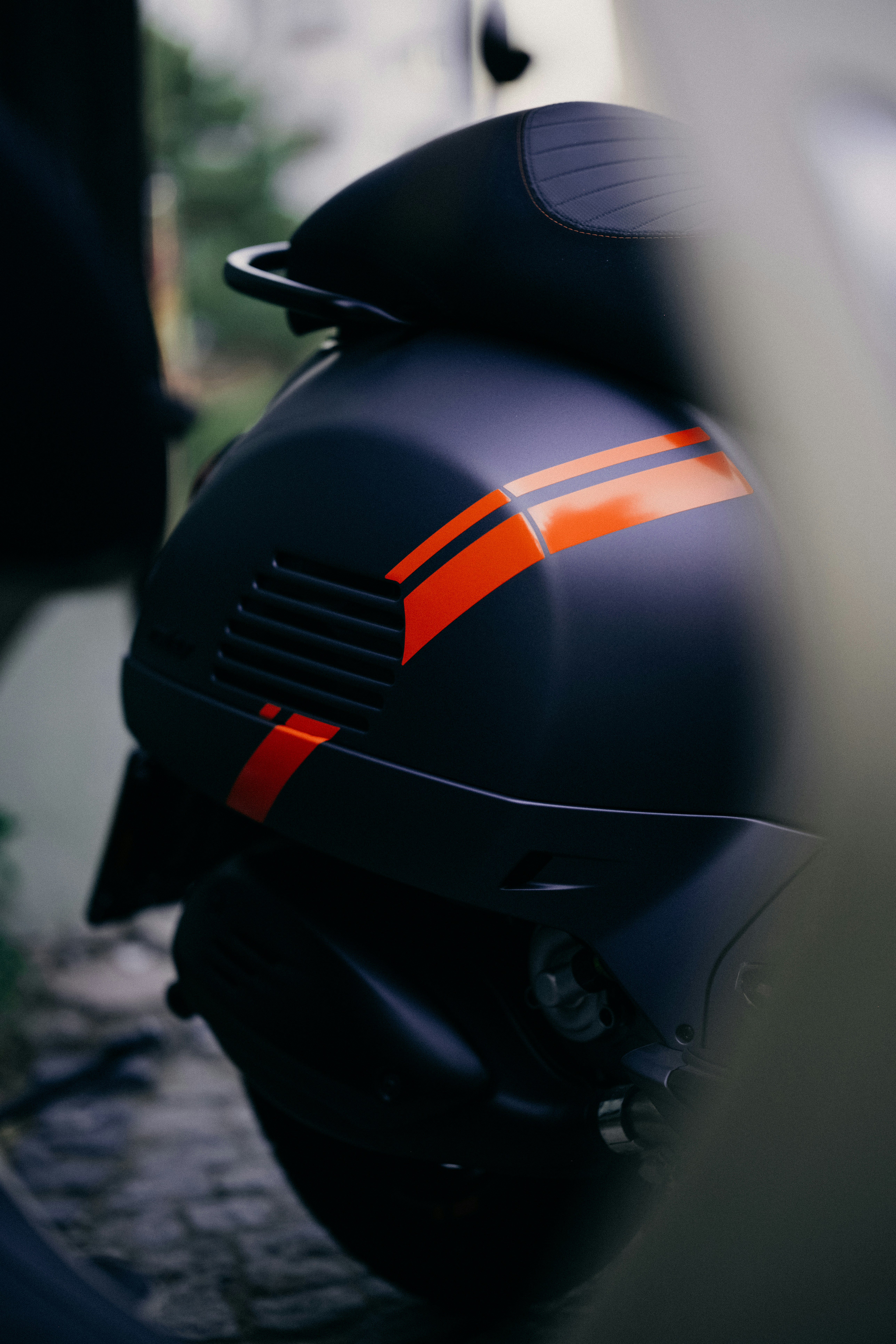Hidden Wheel: Neon Stripes on a Suspended Helmet