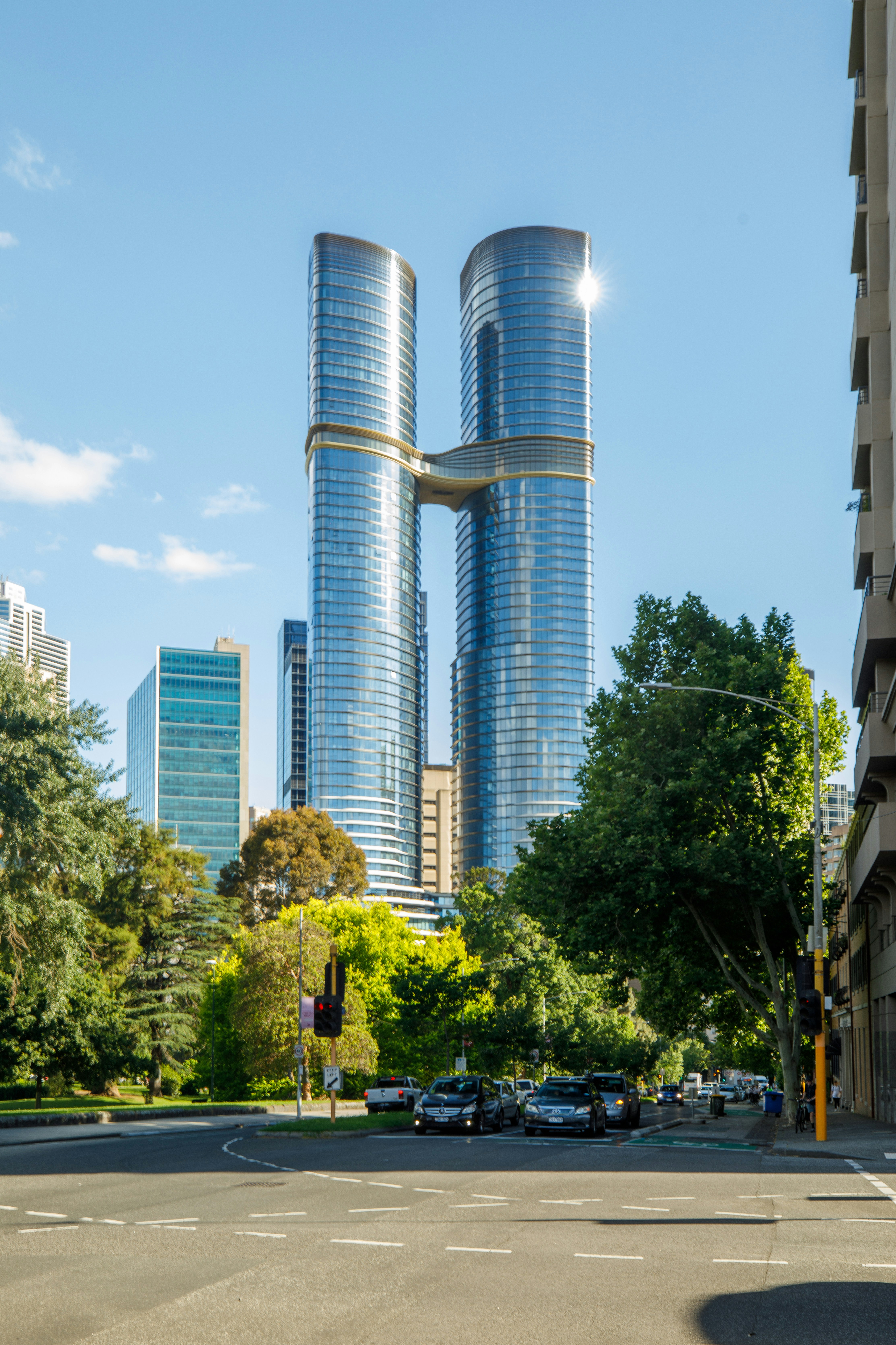 Twin Glass Towers Framed by a Sunlit Skyline