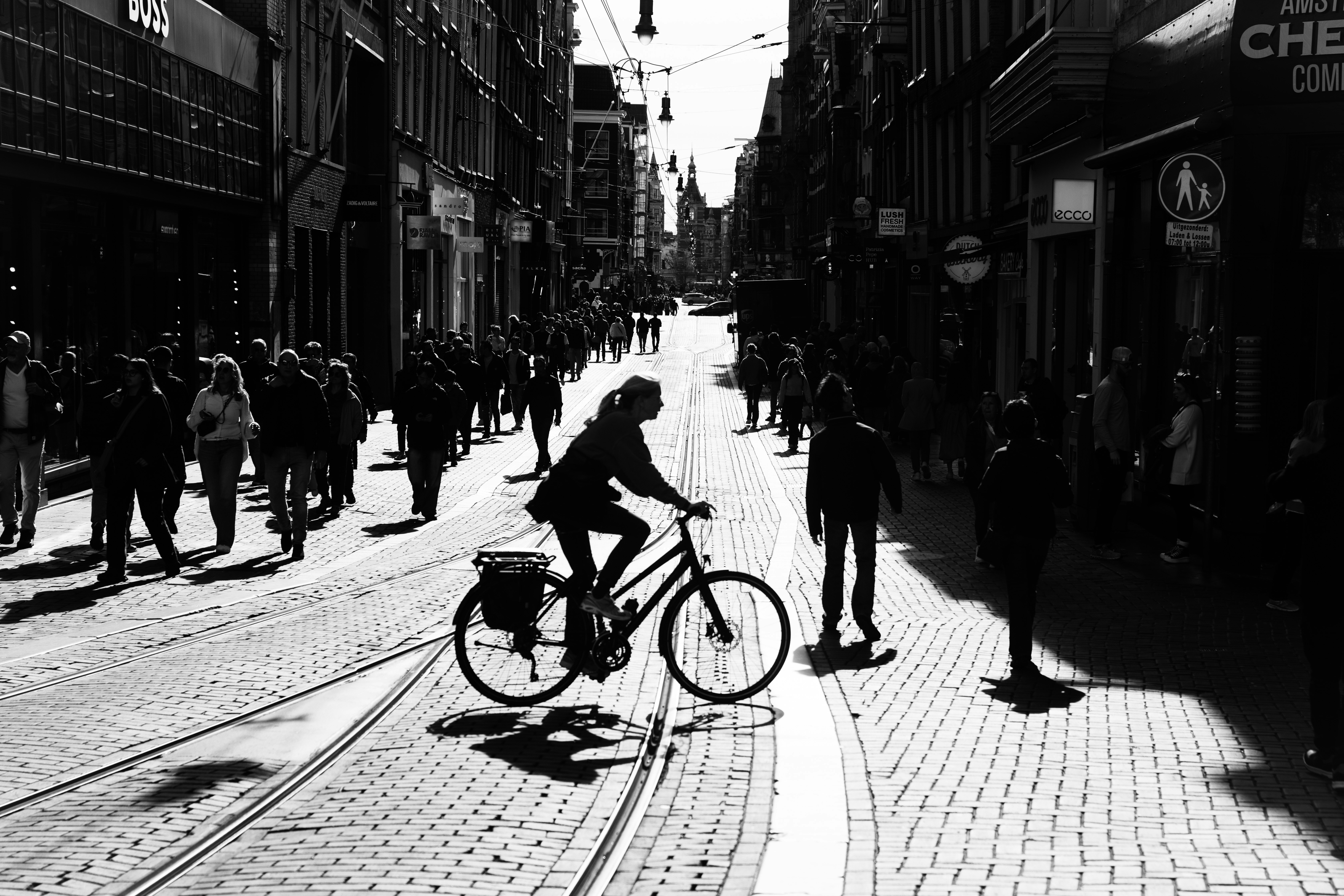 Urban Riser: Cyclist in a Sunlit Alley