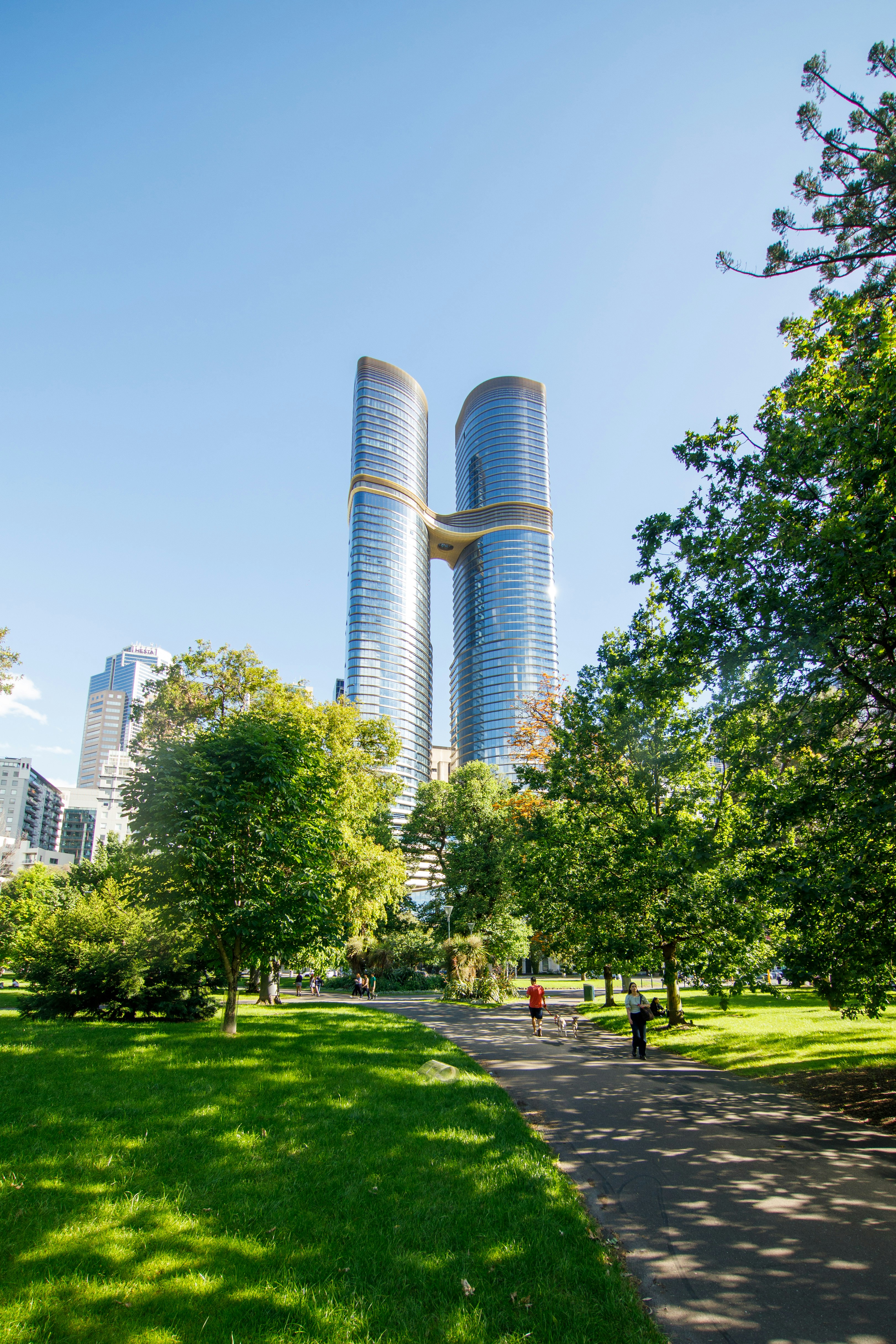 Twin Towers Over the Park: A City Icon Framed by Green Light